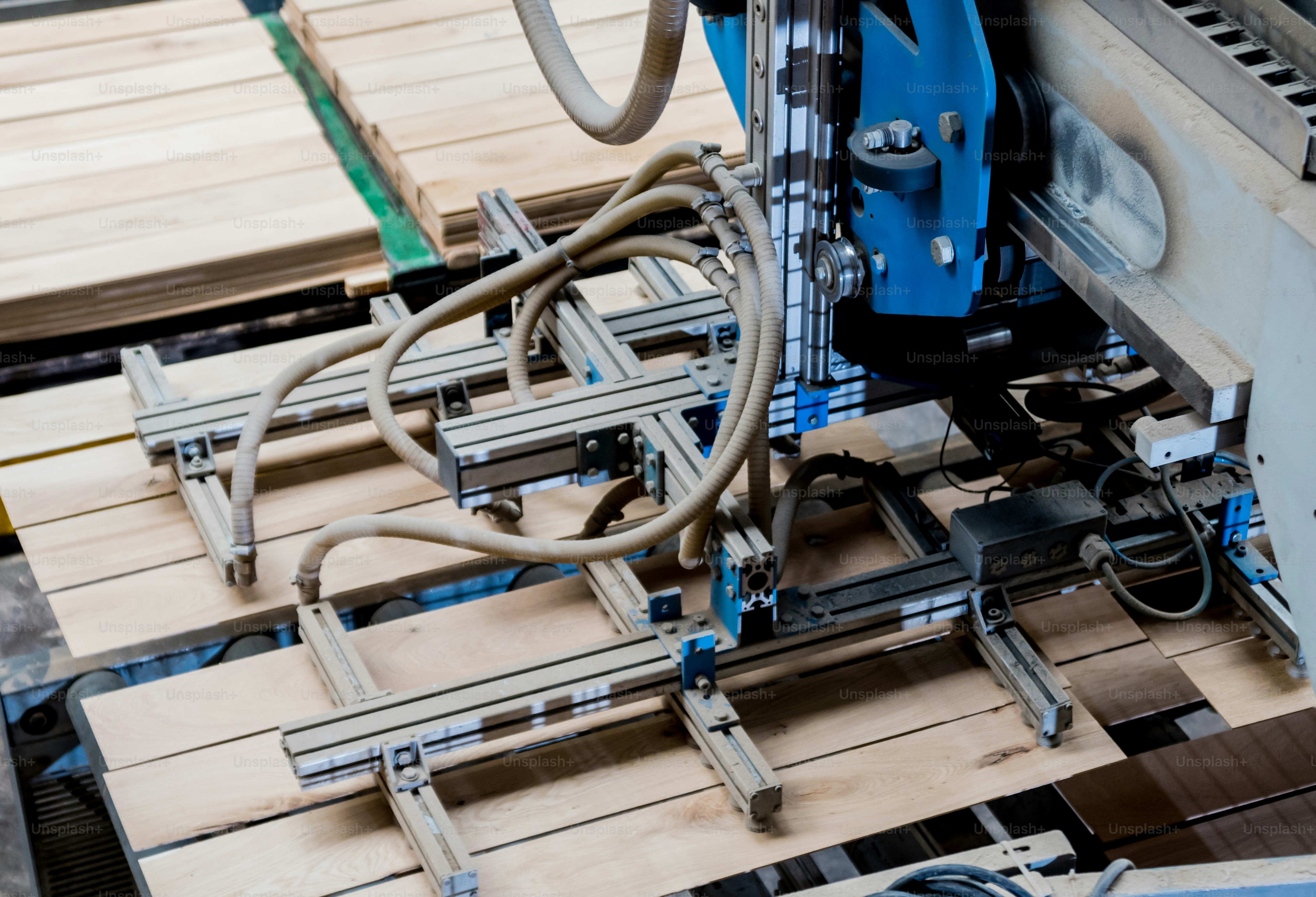 Production line of the wooden floor factory. CNC automatic woodworking ...