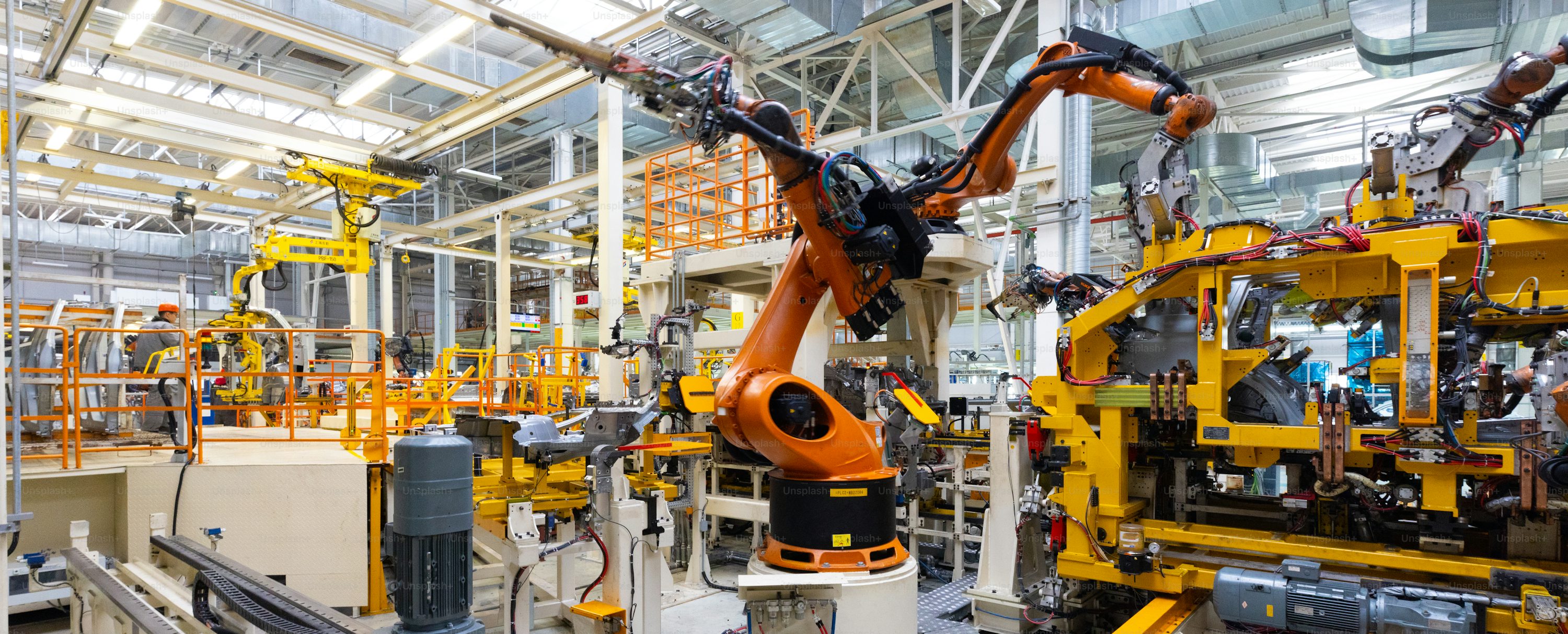 Photo of automobile production line. Welding car body. Modern car ... Photo of automobile production line. Welding car body. Modern car ...