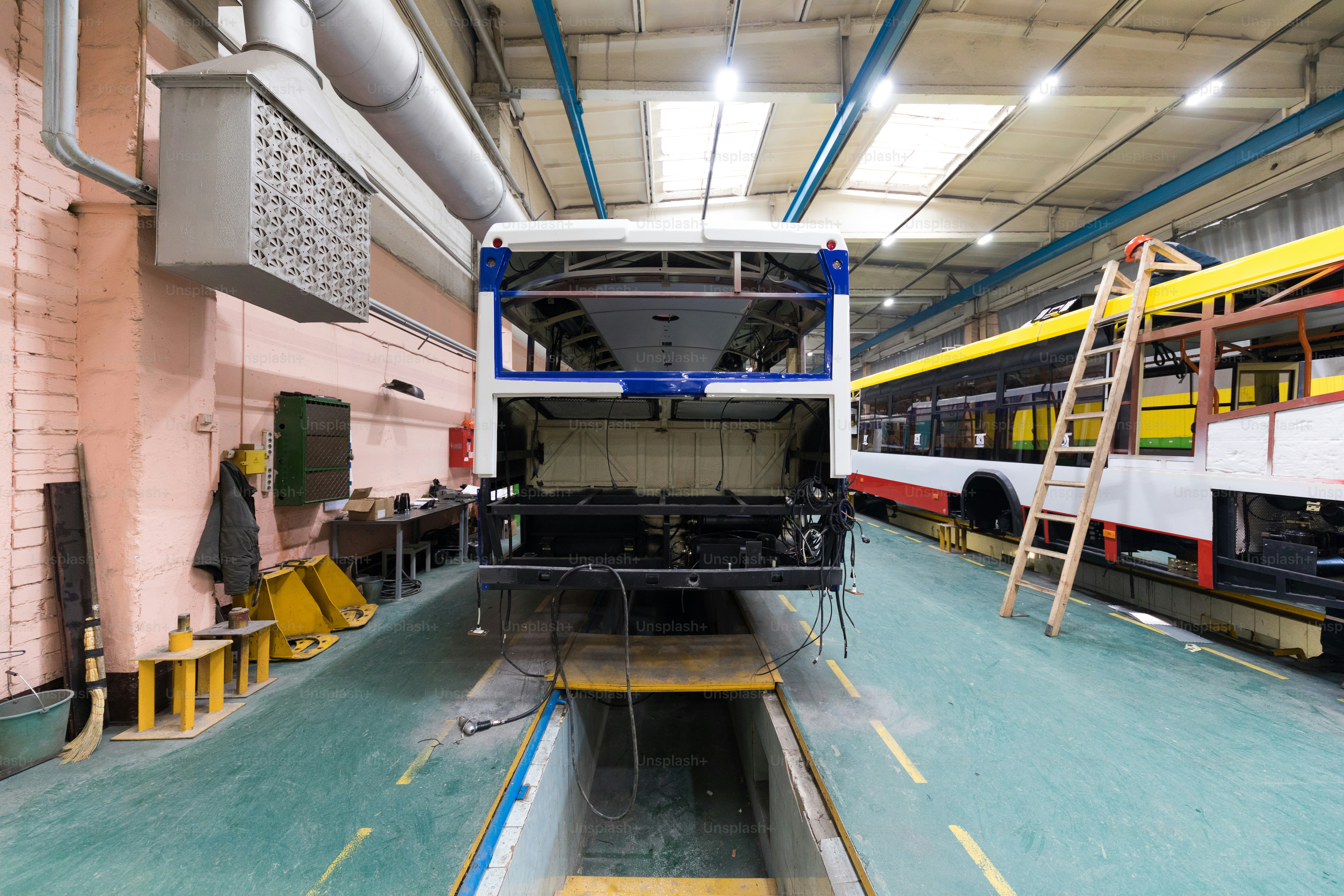One working day of modern automatic bus manufacturing with unfinished ...