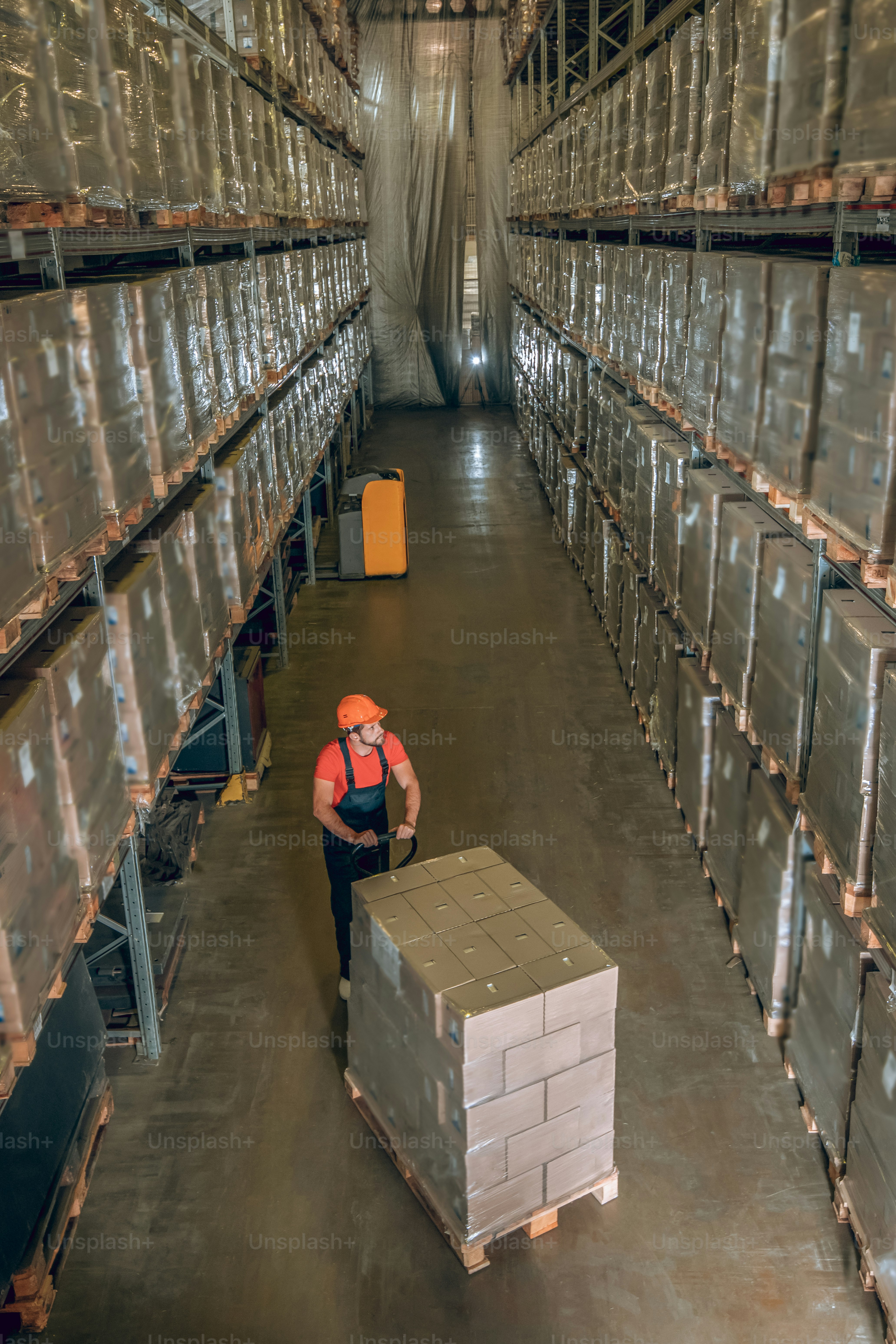 Warehouse. View of a person in a storage compartment with lots of ...