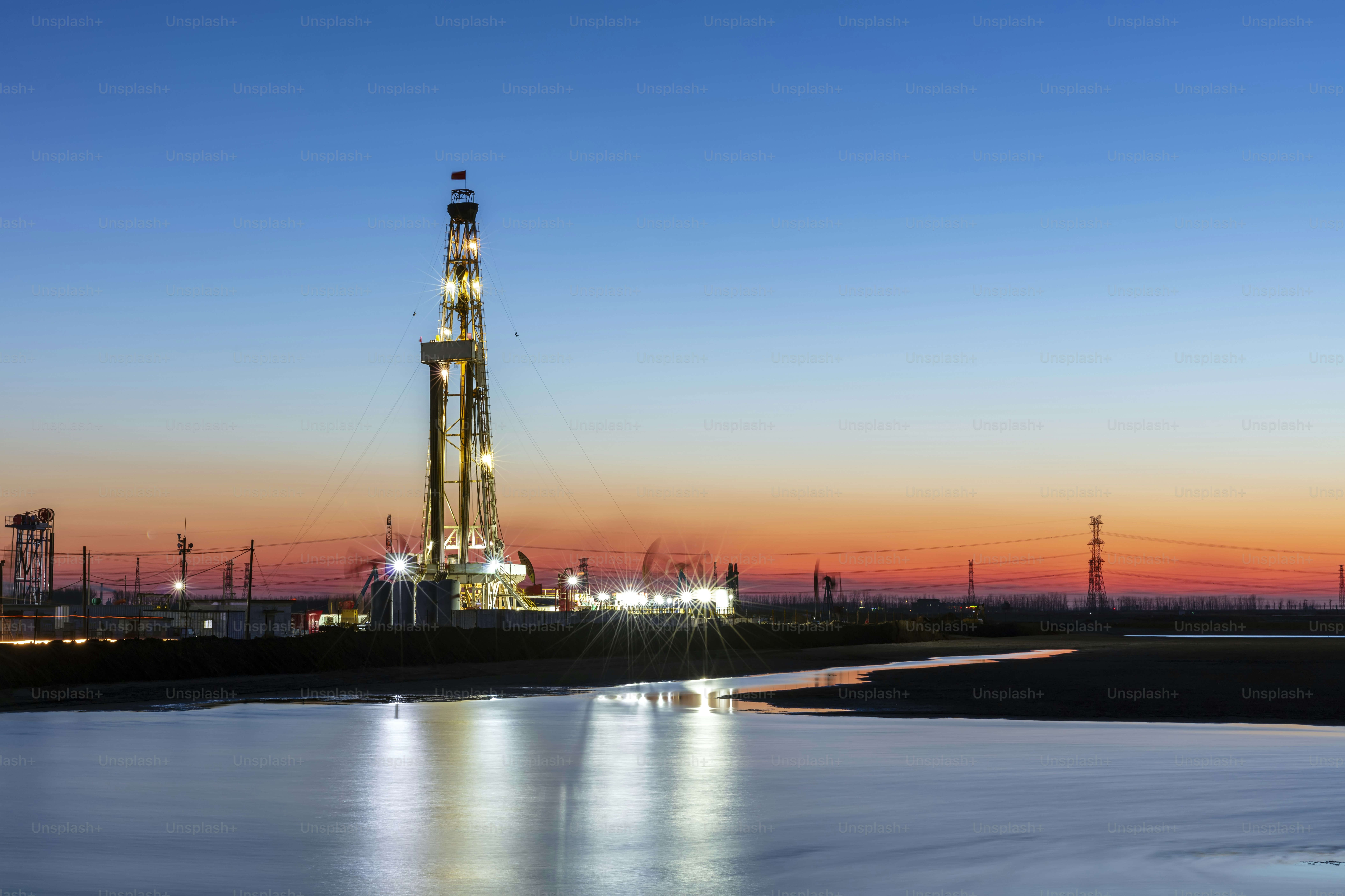Oil field, In the evening of oilfield derrick photo – Oil well Image on ...