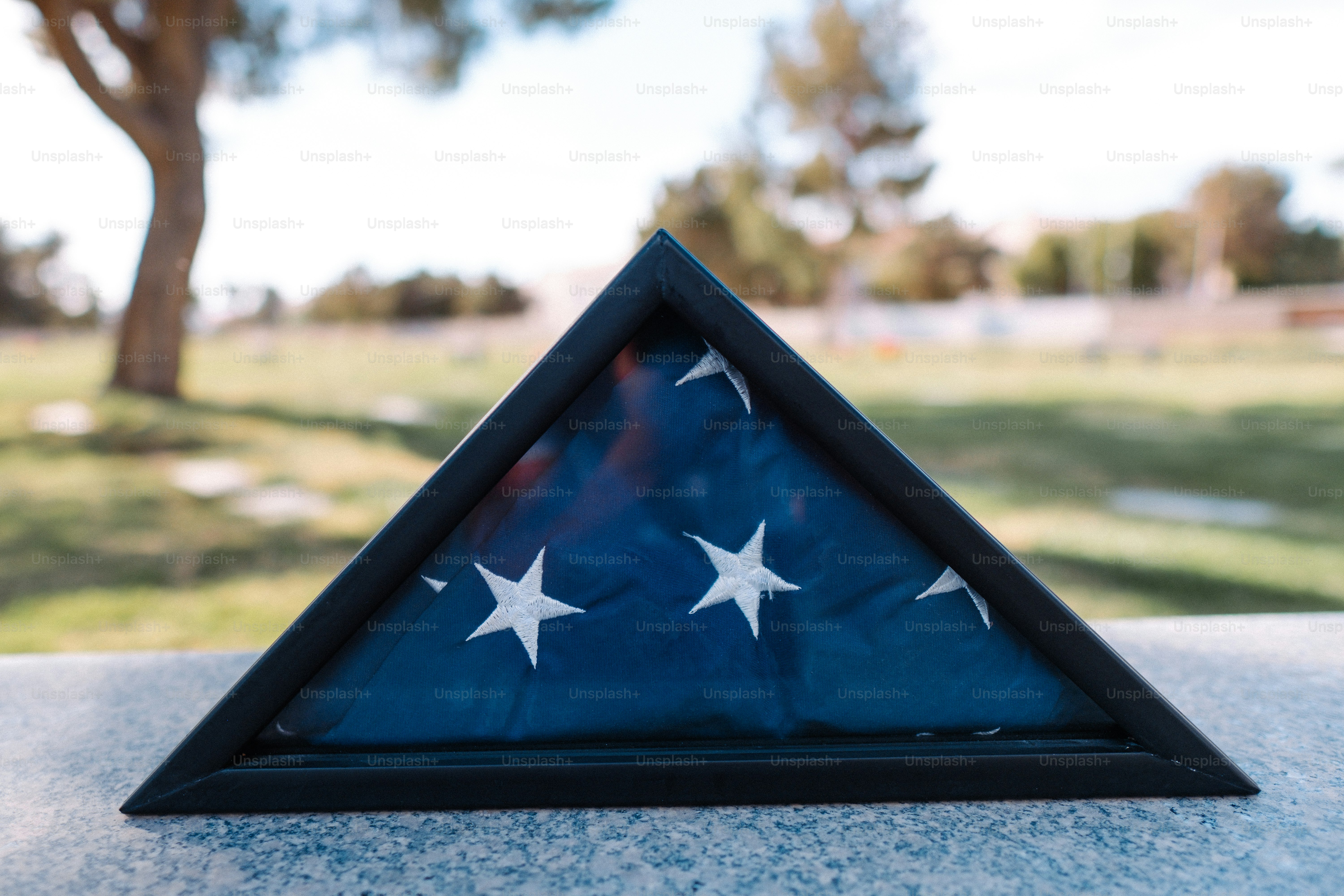 A triangle shaped flag on top of a table photo – Patriotic Image on ...