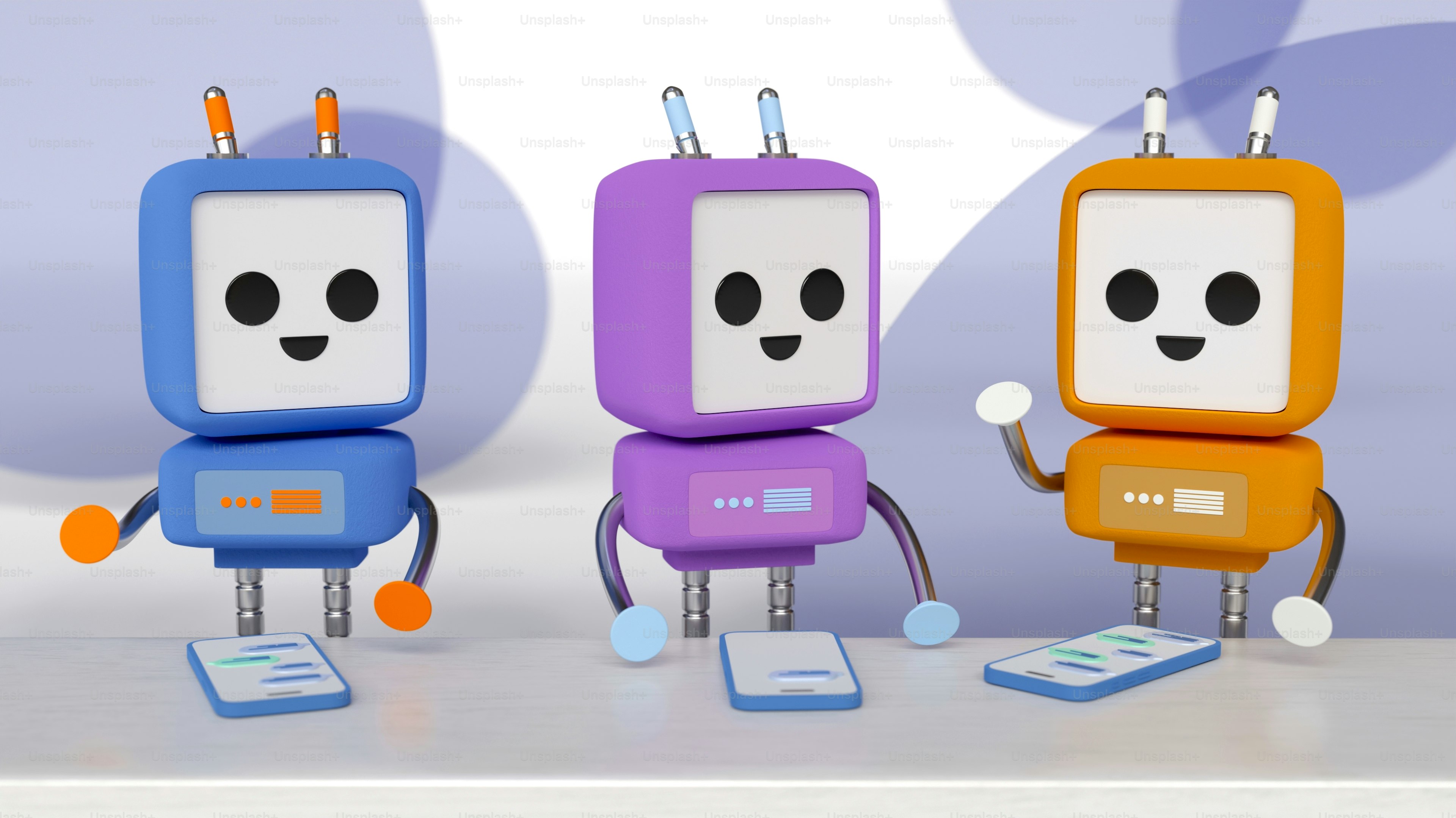 A group of three little robots standing next to each other photo ...