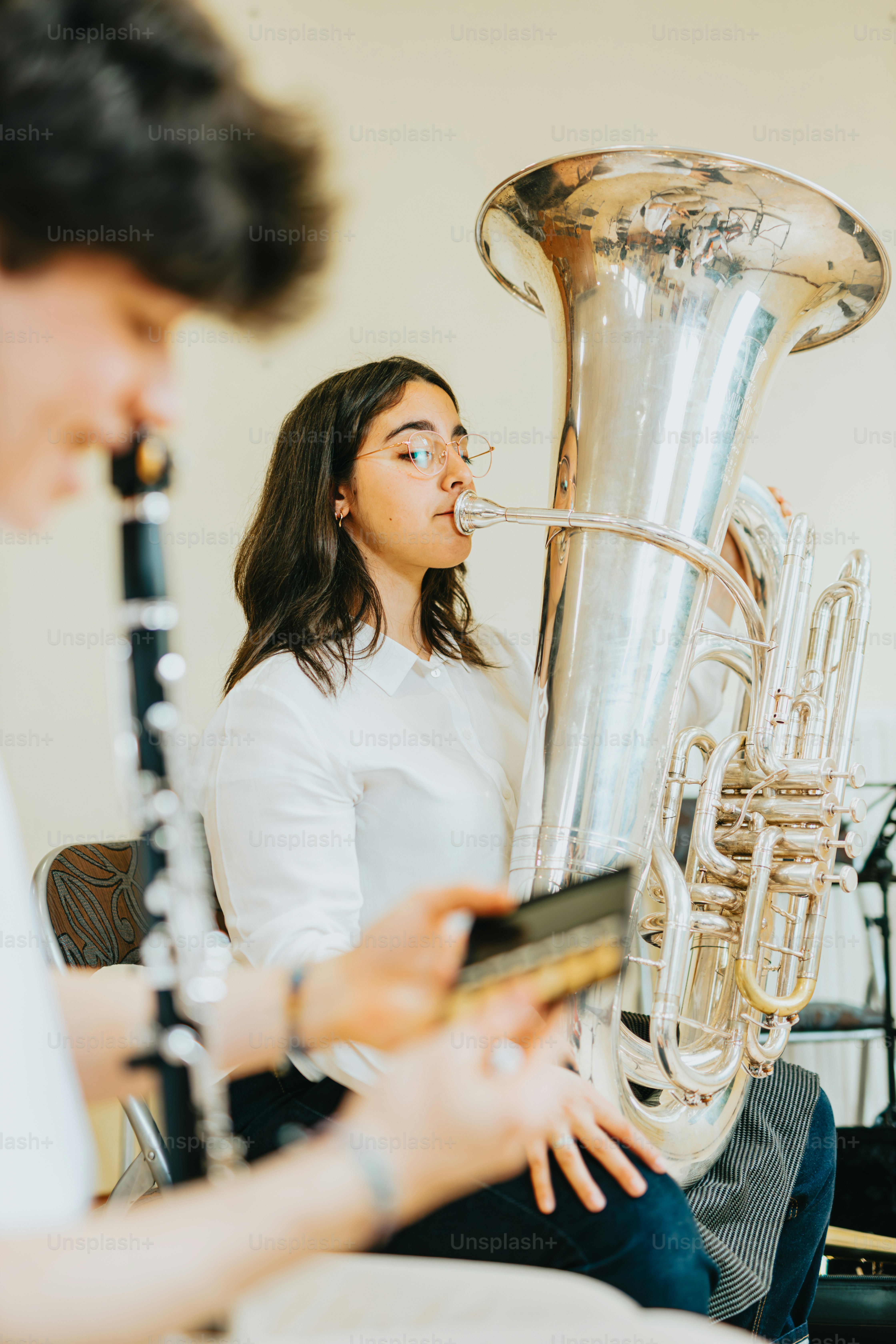 A group of people playing instruments in front of a blackboard photo ...