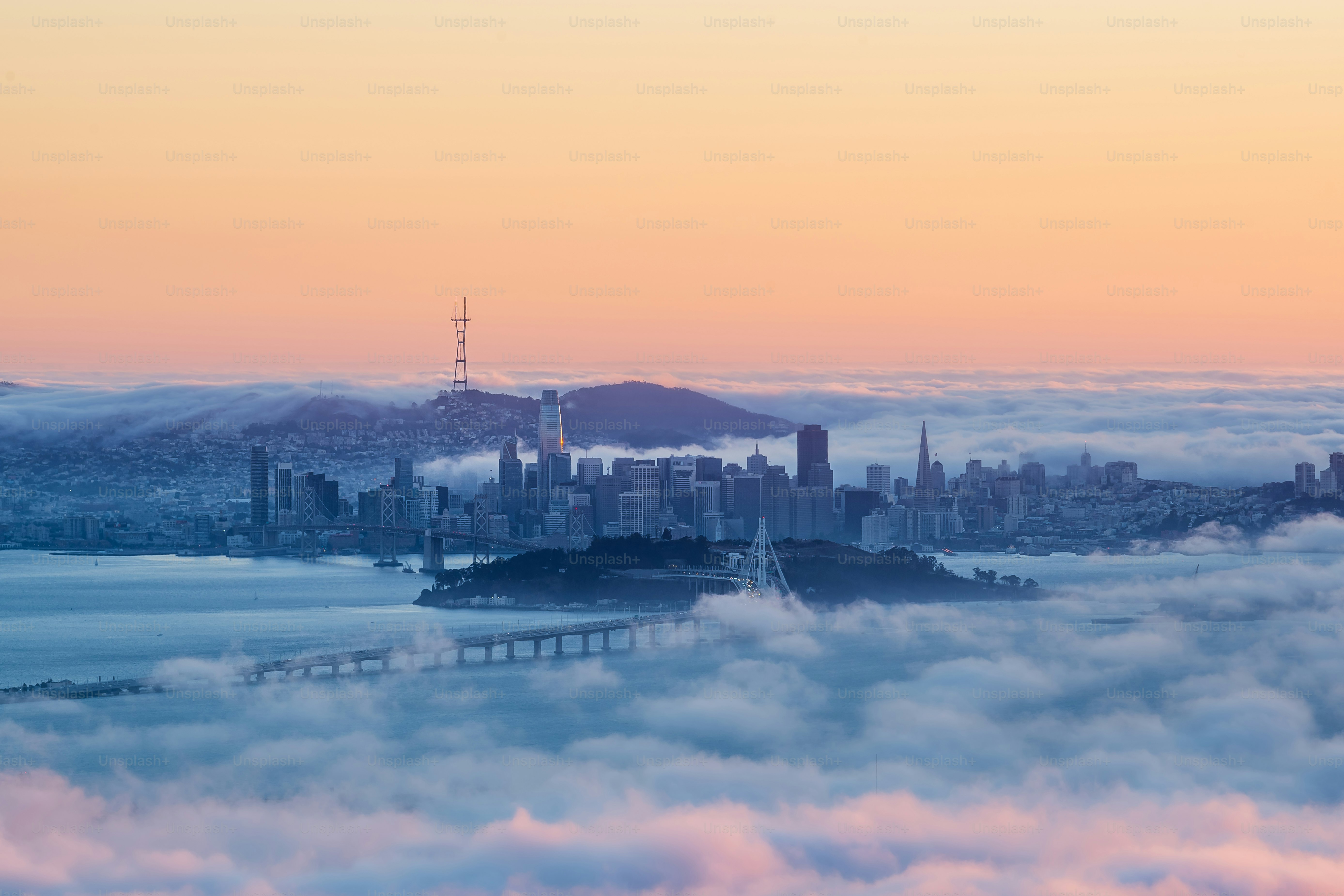 A view of a city from above the clouds photo – City Image on Unsplash