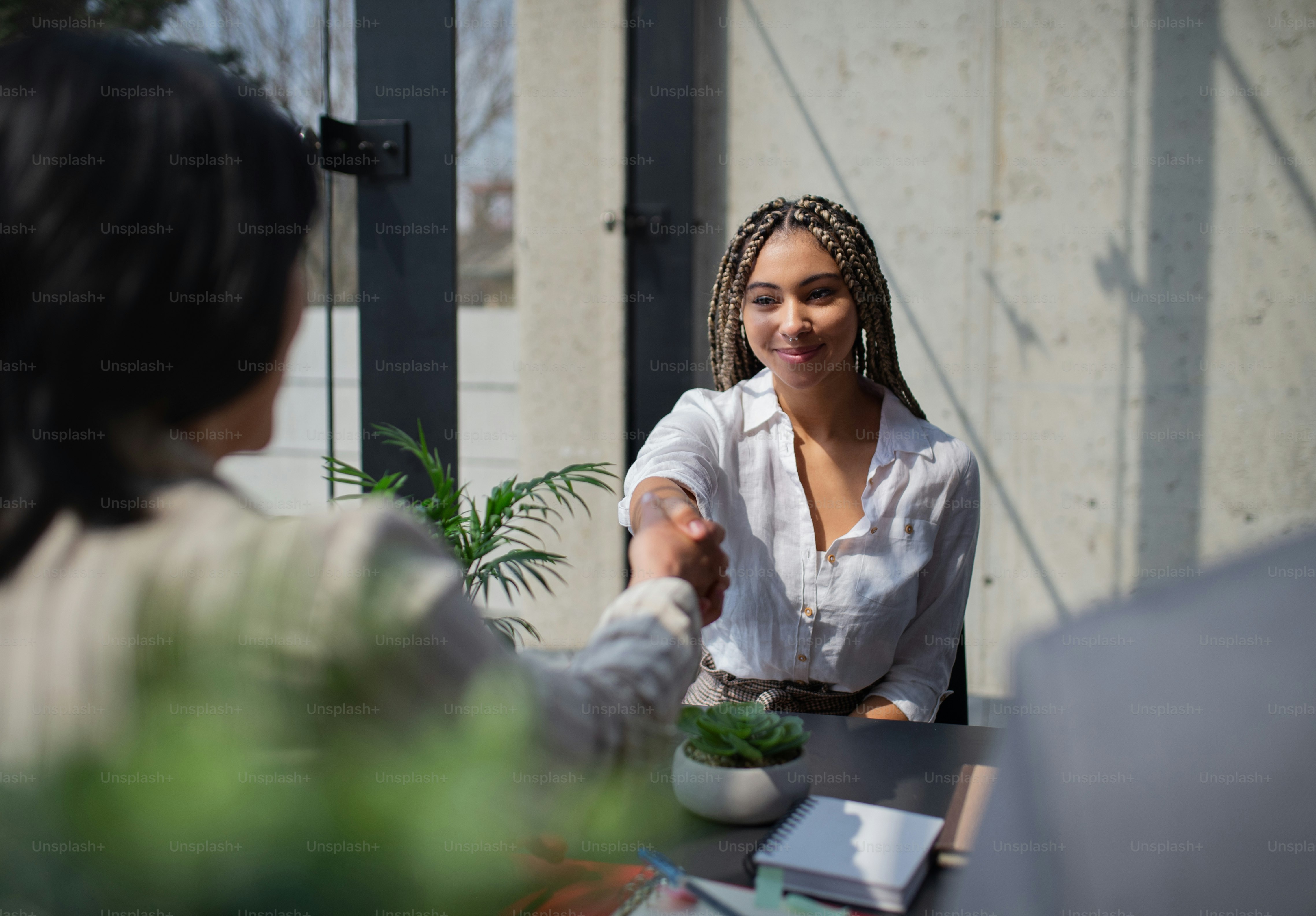 A happy young woman having job interview in office, business and career ...