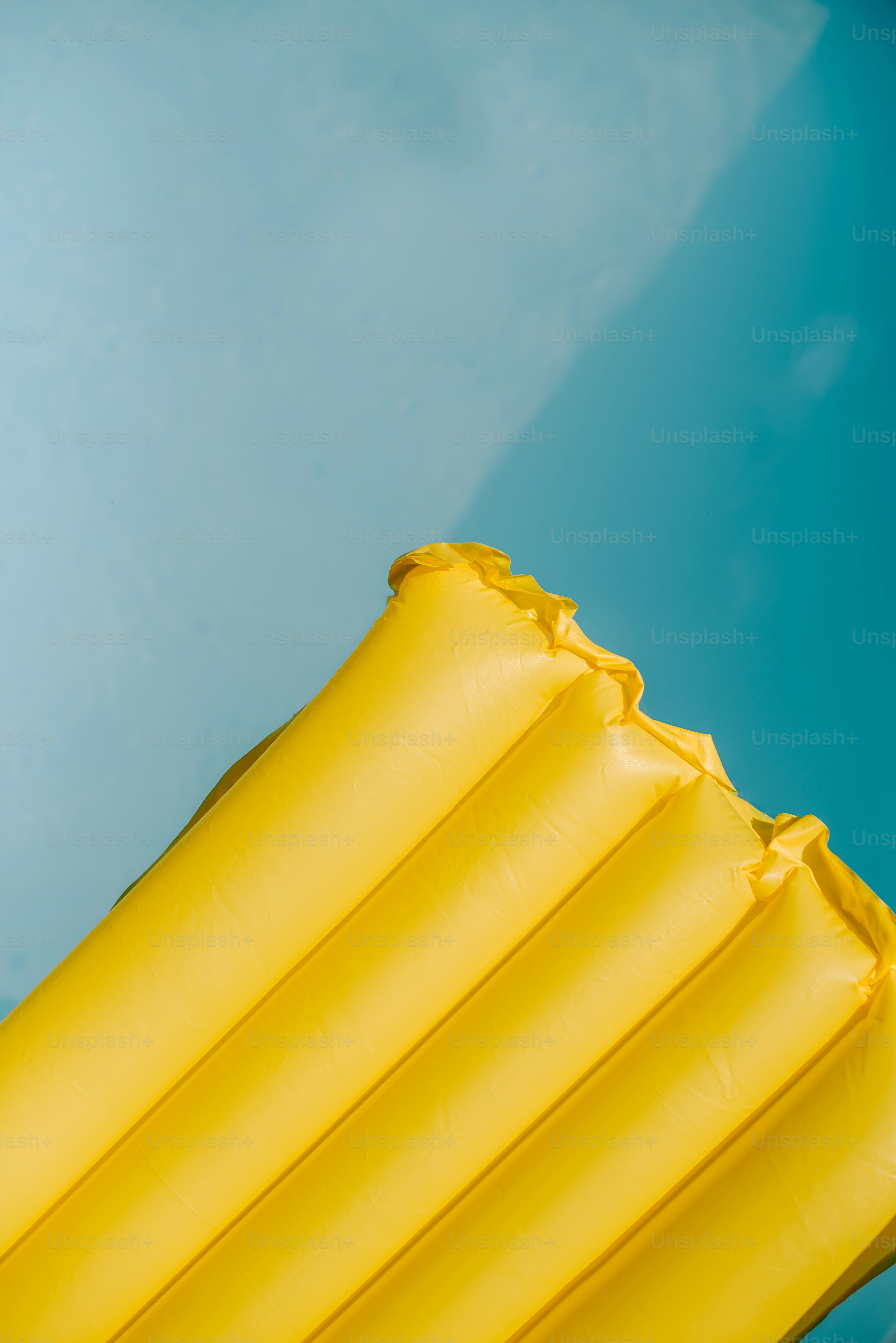 A yellow raft floating on top of a body of water photo – Wallpaper ...