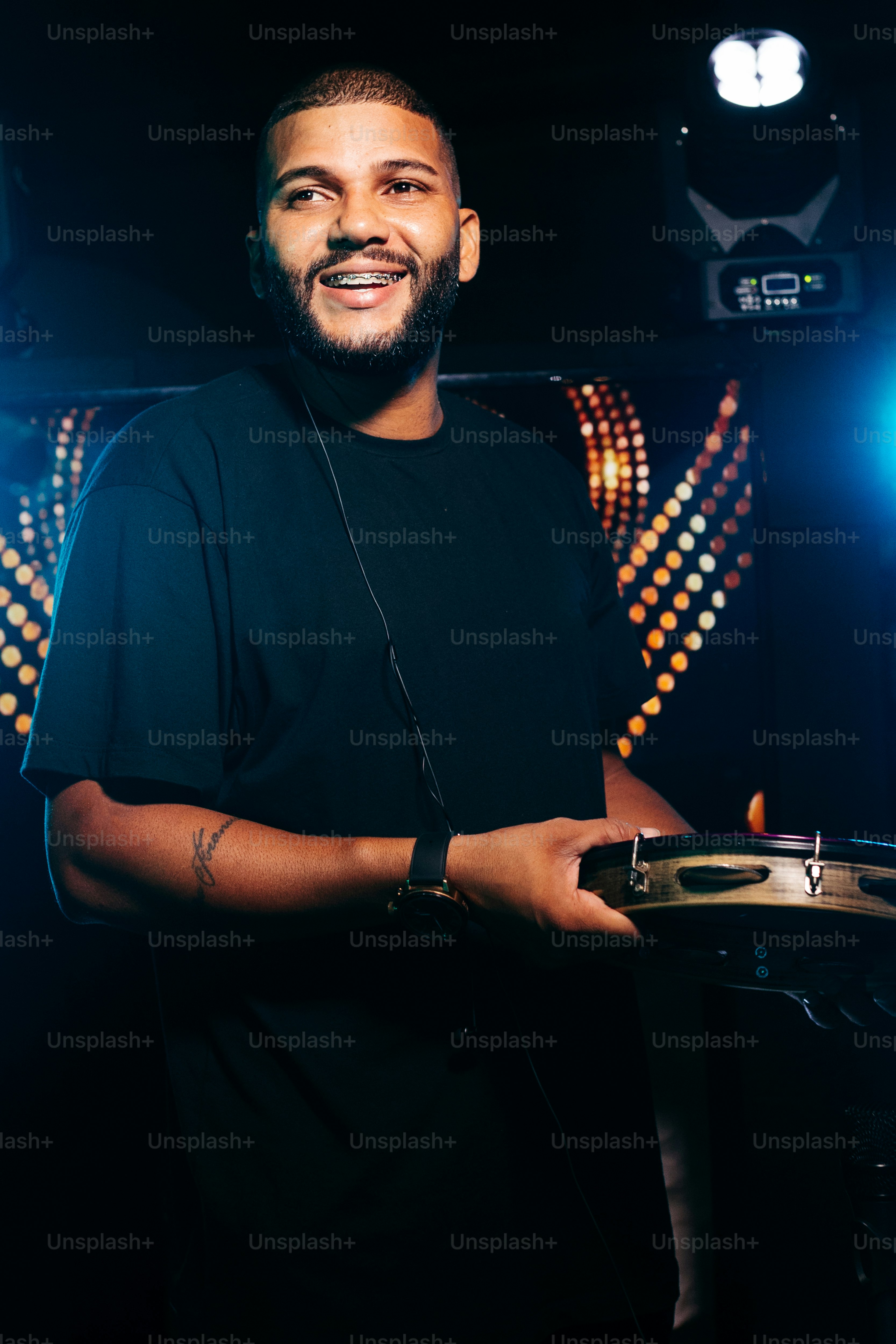 A man standing in front of a drum set photo – Face man Image on Unsplash