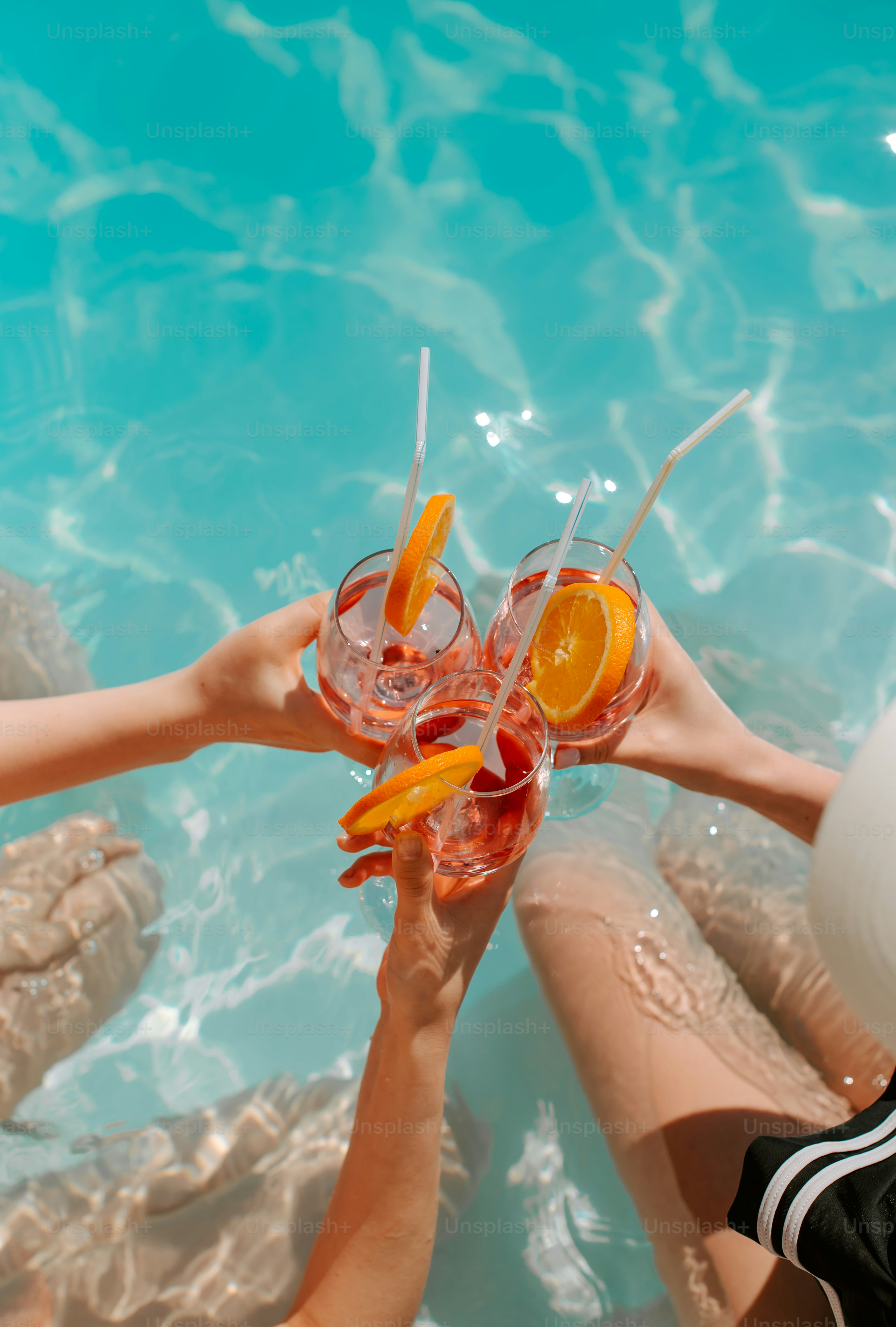 A group of people floating in a pool on inflatable rafts photo – Summer ...