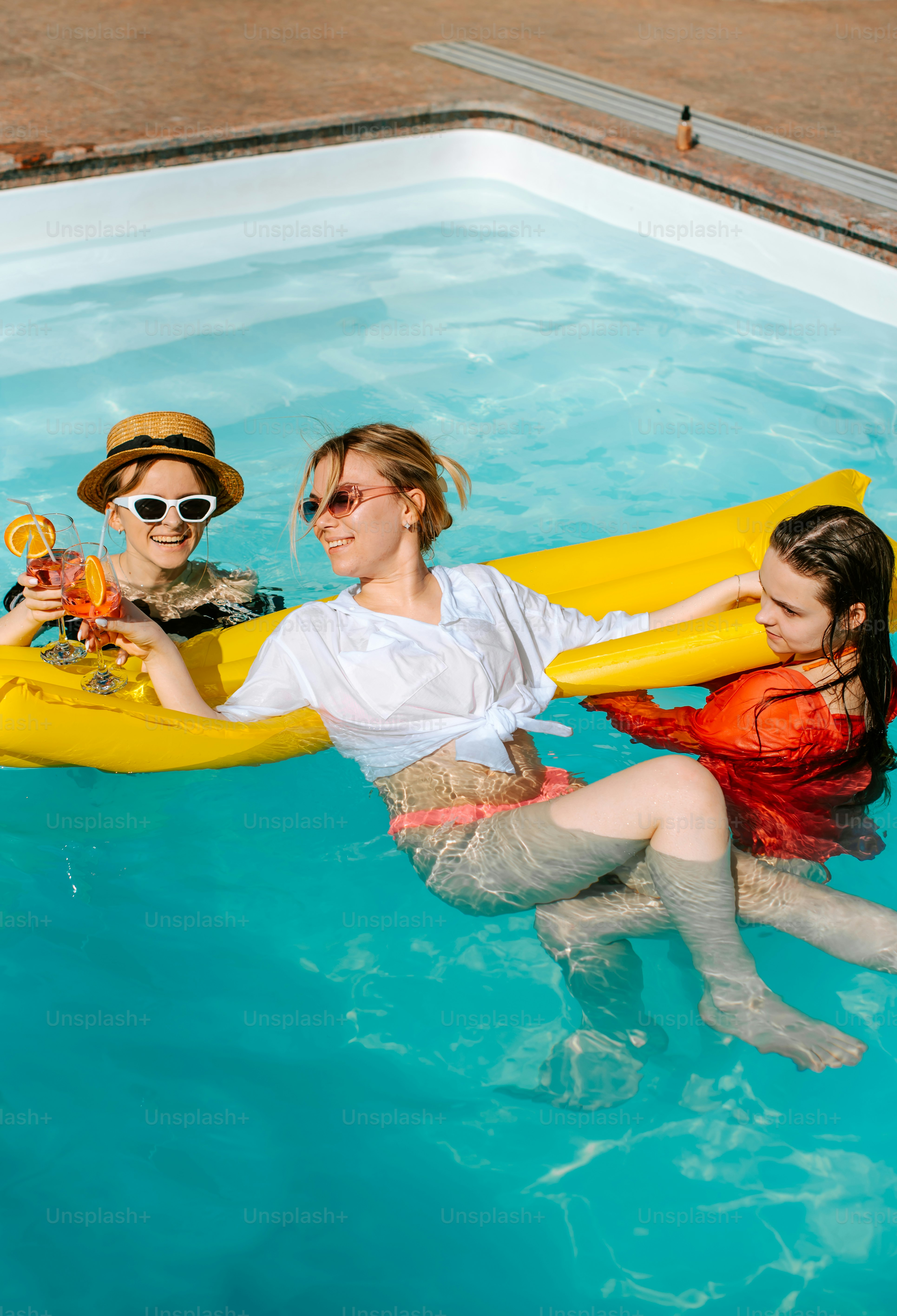 A group of people in a swimming pool photo – Having fun Image on Unsplash