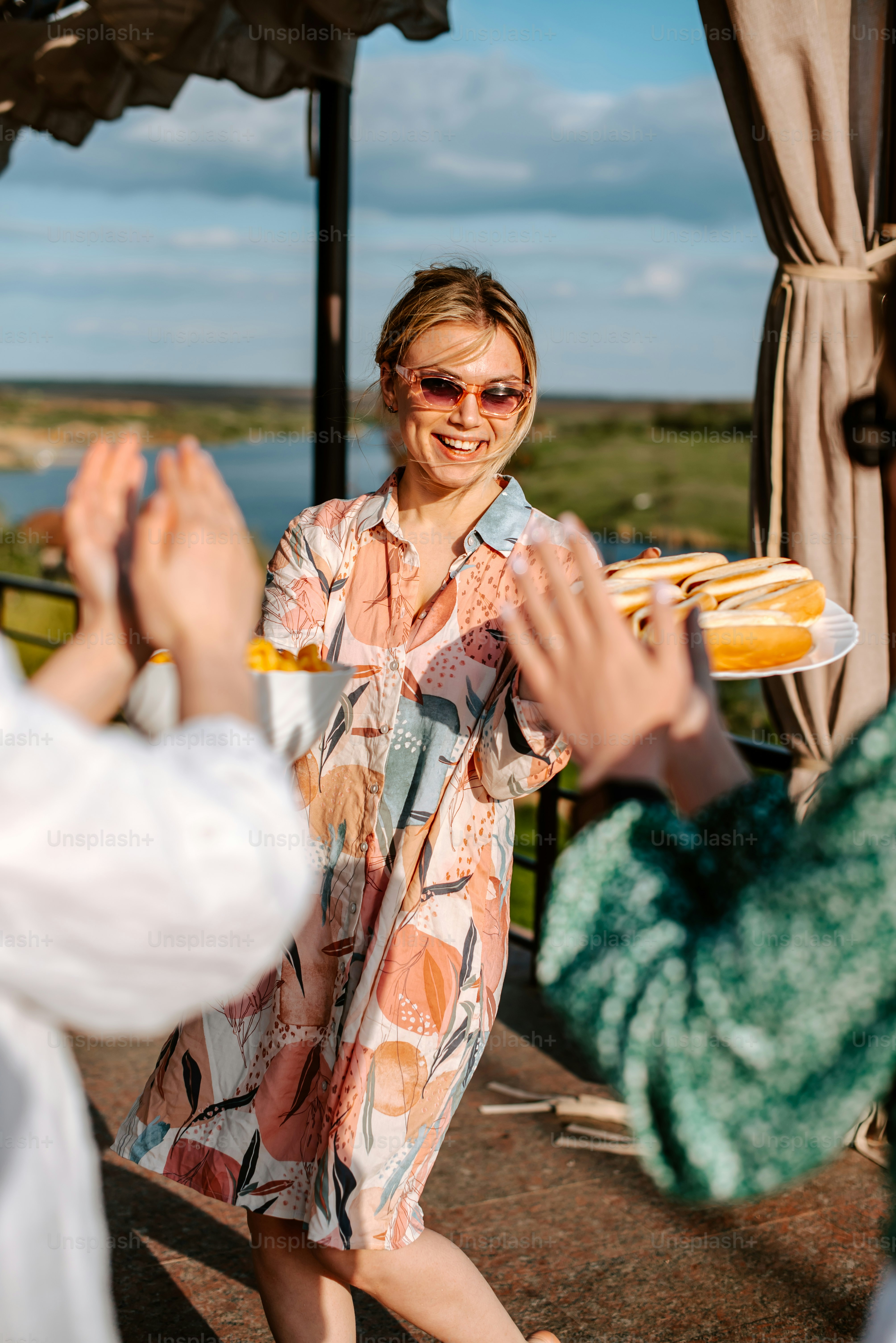 A group of people toasting with drinks in a pool photo – People Image ...