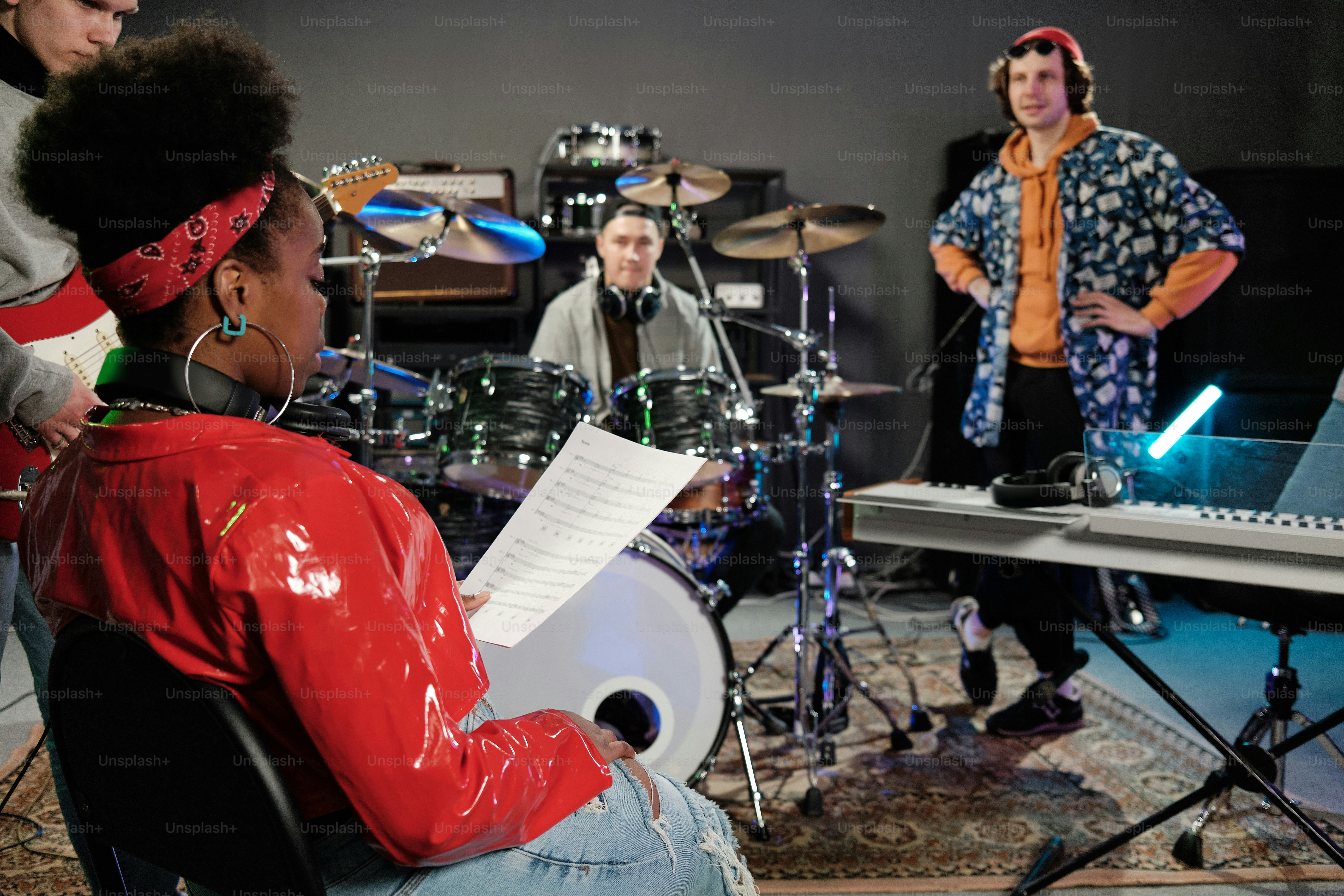 A group of people in a recording studio photo – Drummer Image on Unsplash