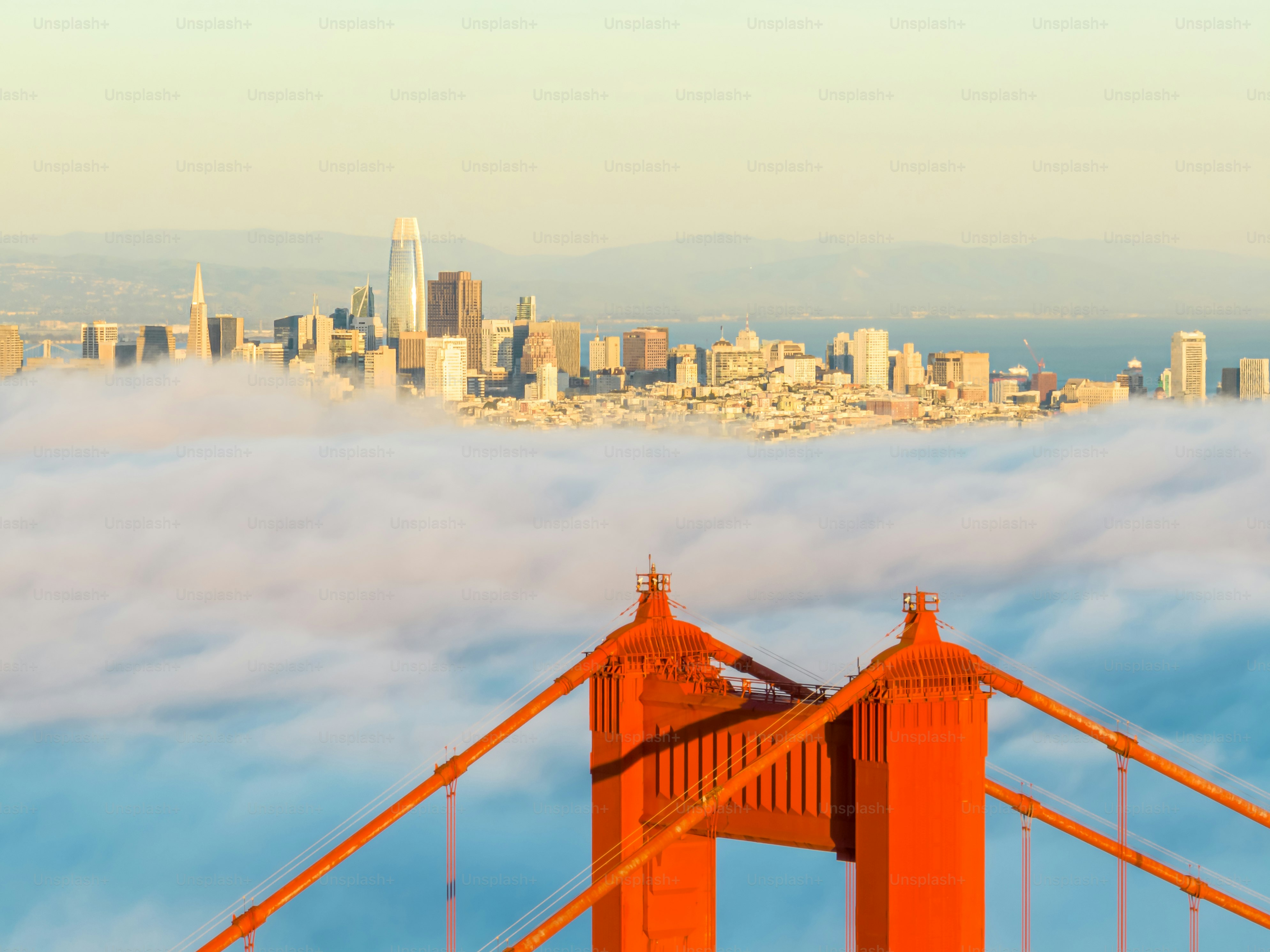 A view of a city in the distance with a bridge in the foreground photo ...