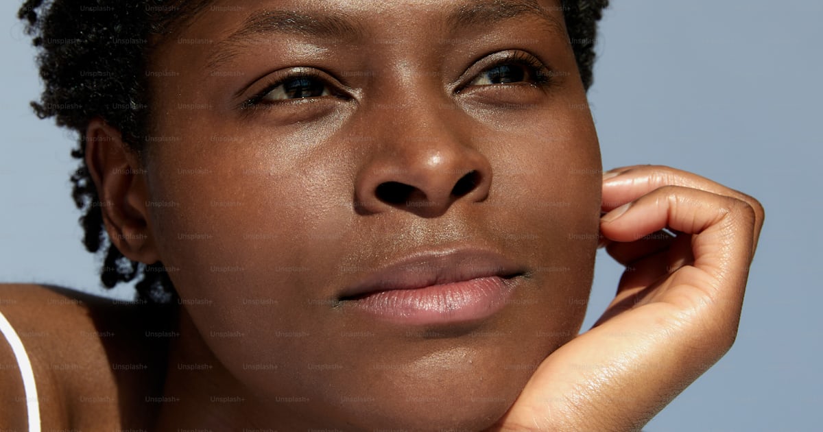 A Close Up Of A Person Wearing A Tank Top Photo Woman Image On Unsplash