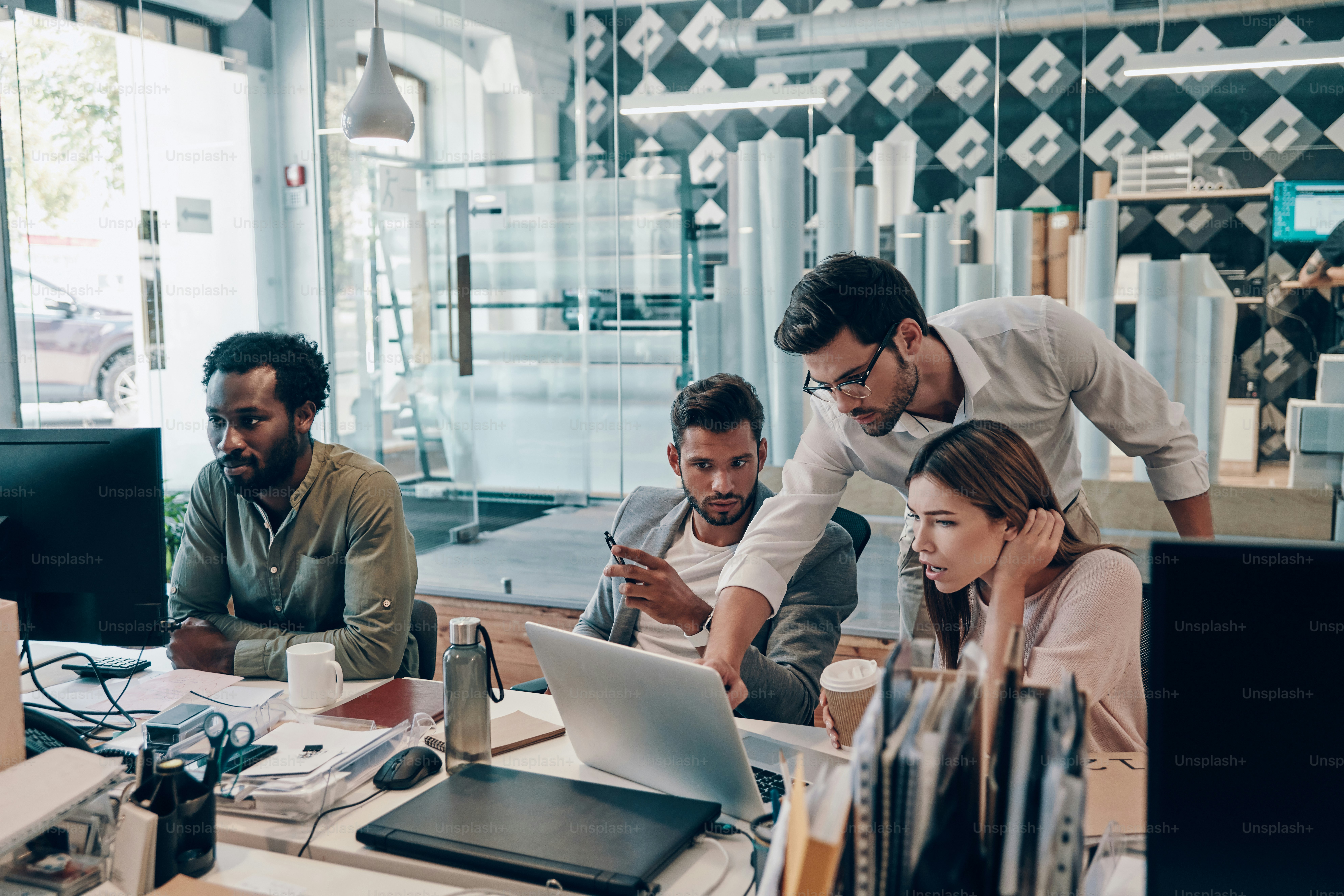 Group of young modern people in smart casual wear communicating and ...