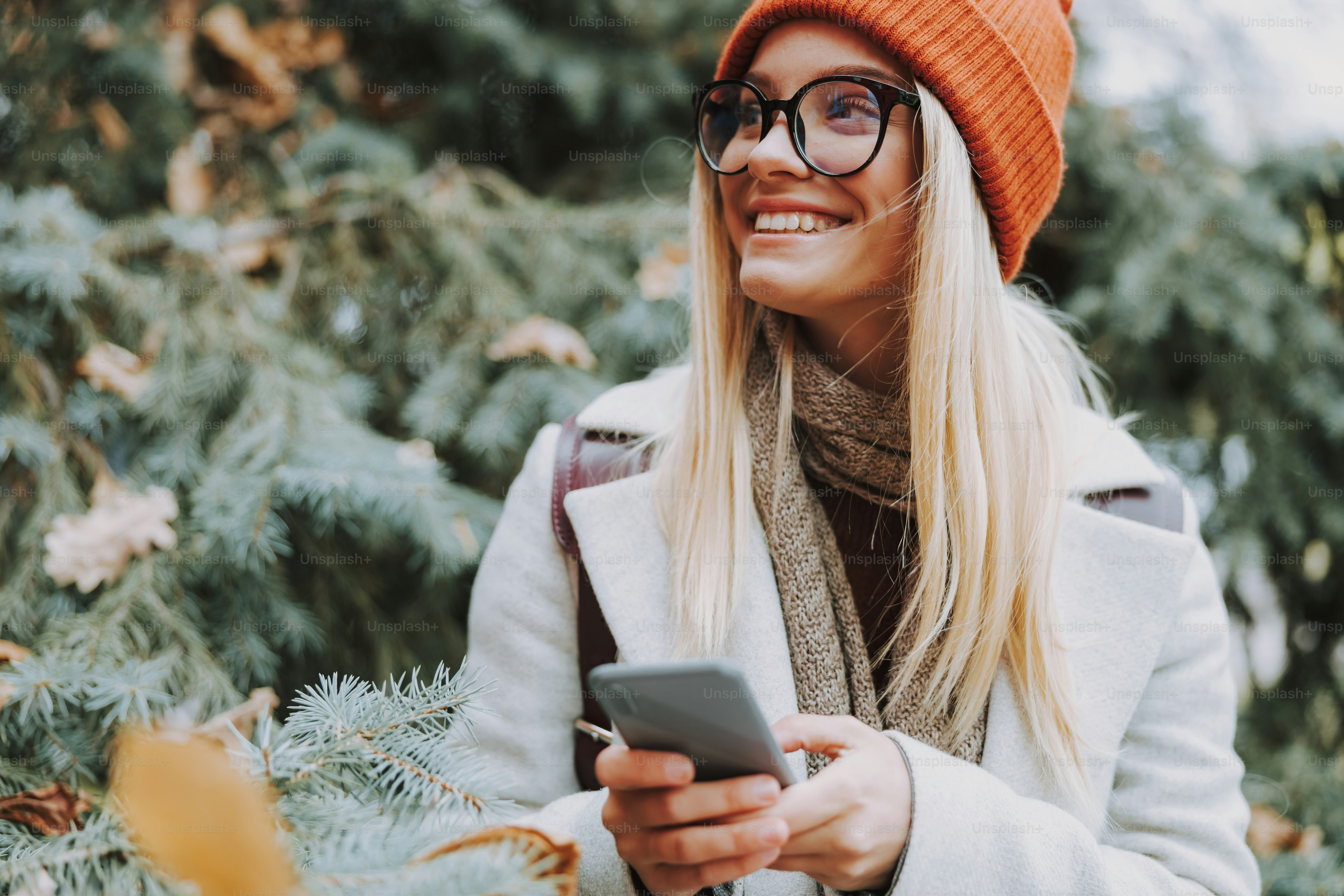 Happy girl smiling wide and standing near tree outdoors photo – Nature ...