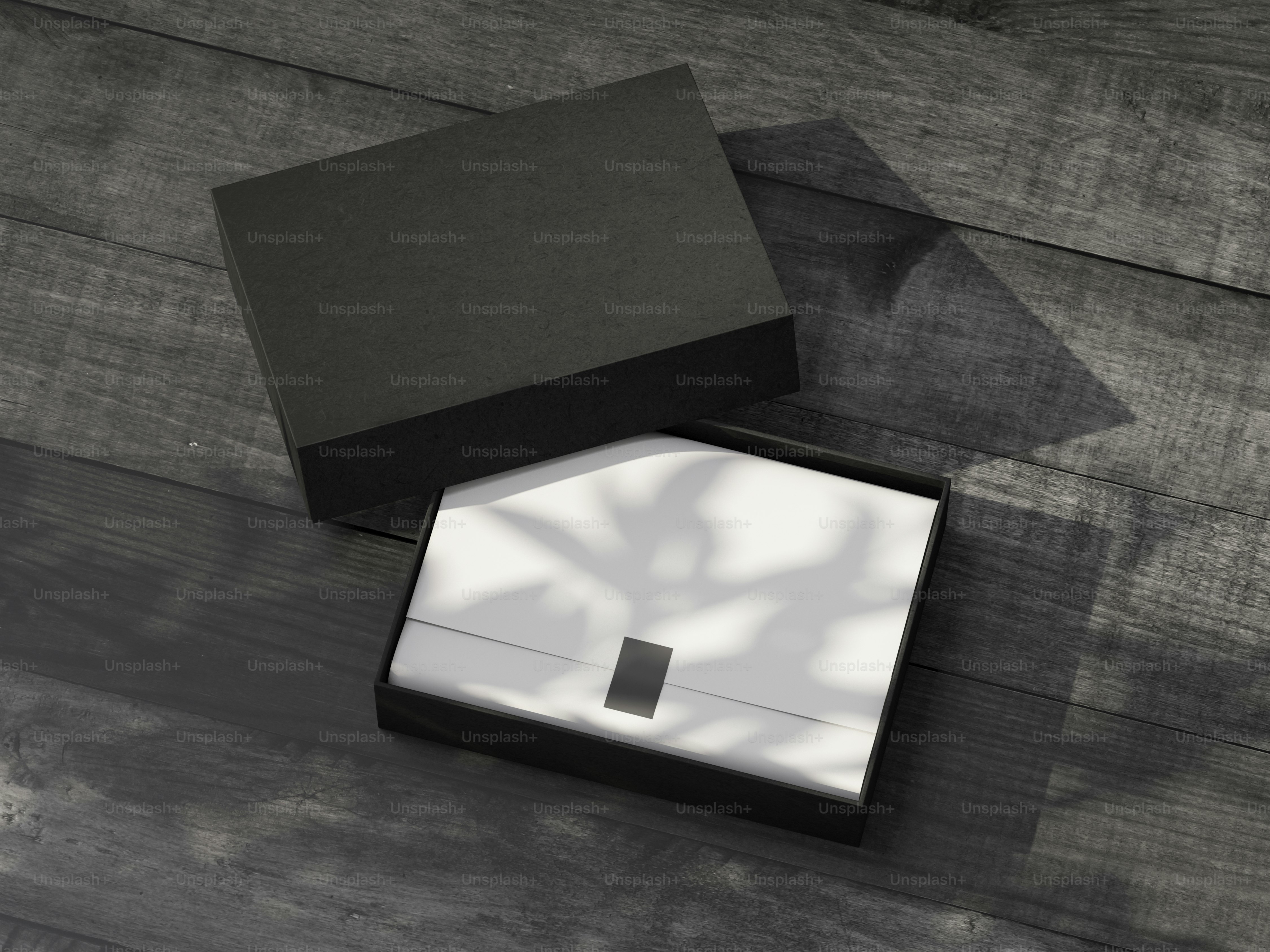 Opened black Gift Box Mockup with white wrapping paper on the wooden ...