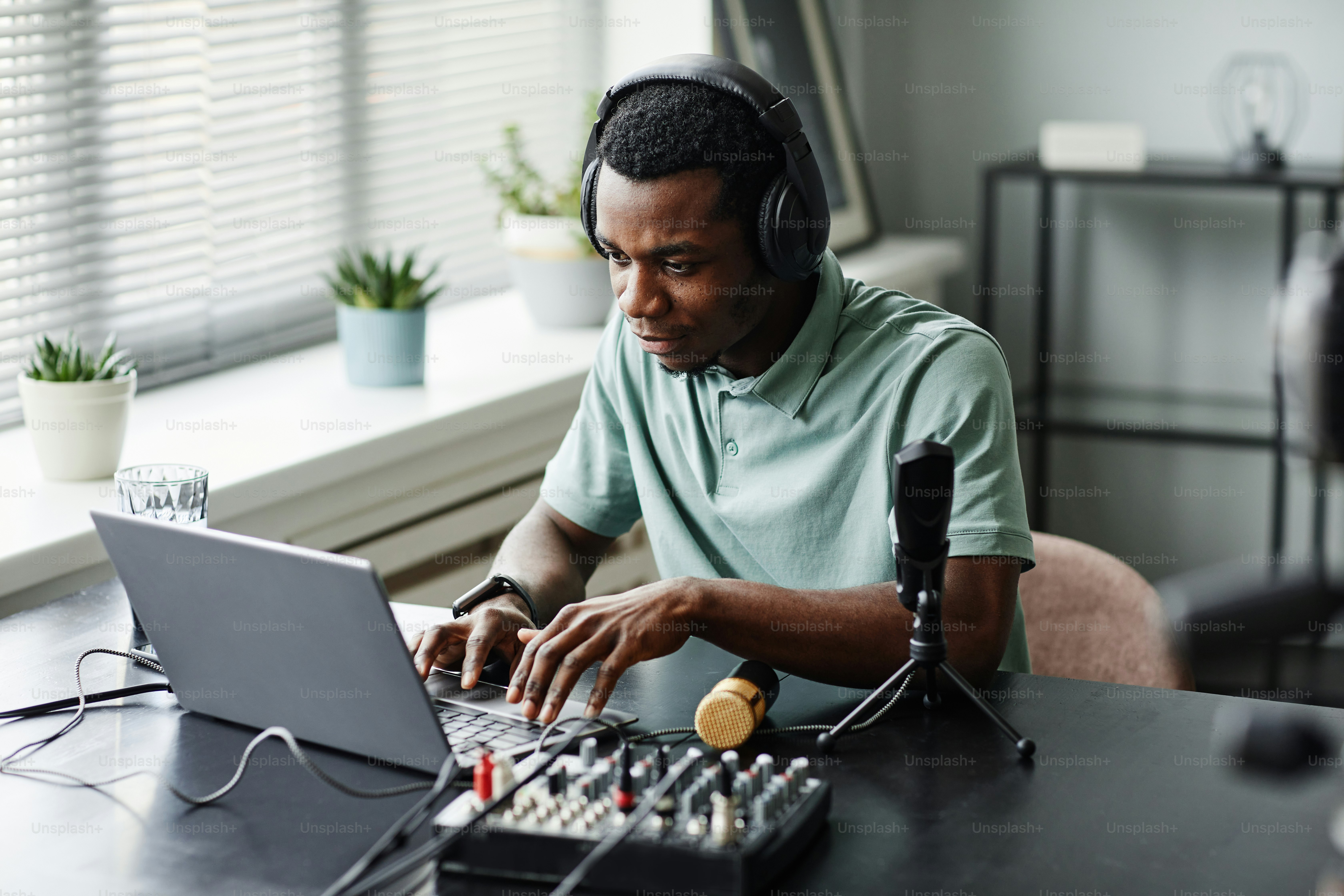 High angle portrait of African-American man setting up recording ...