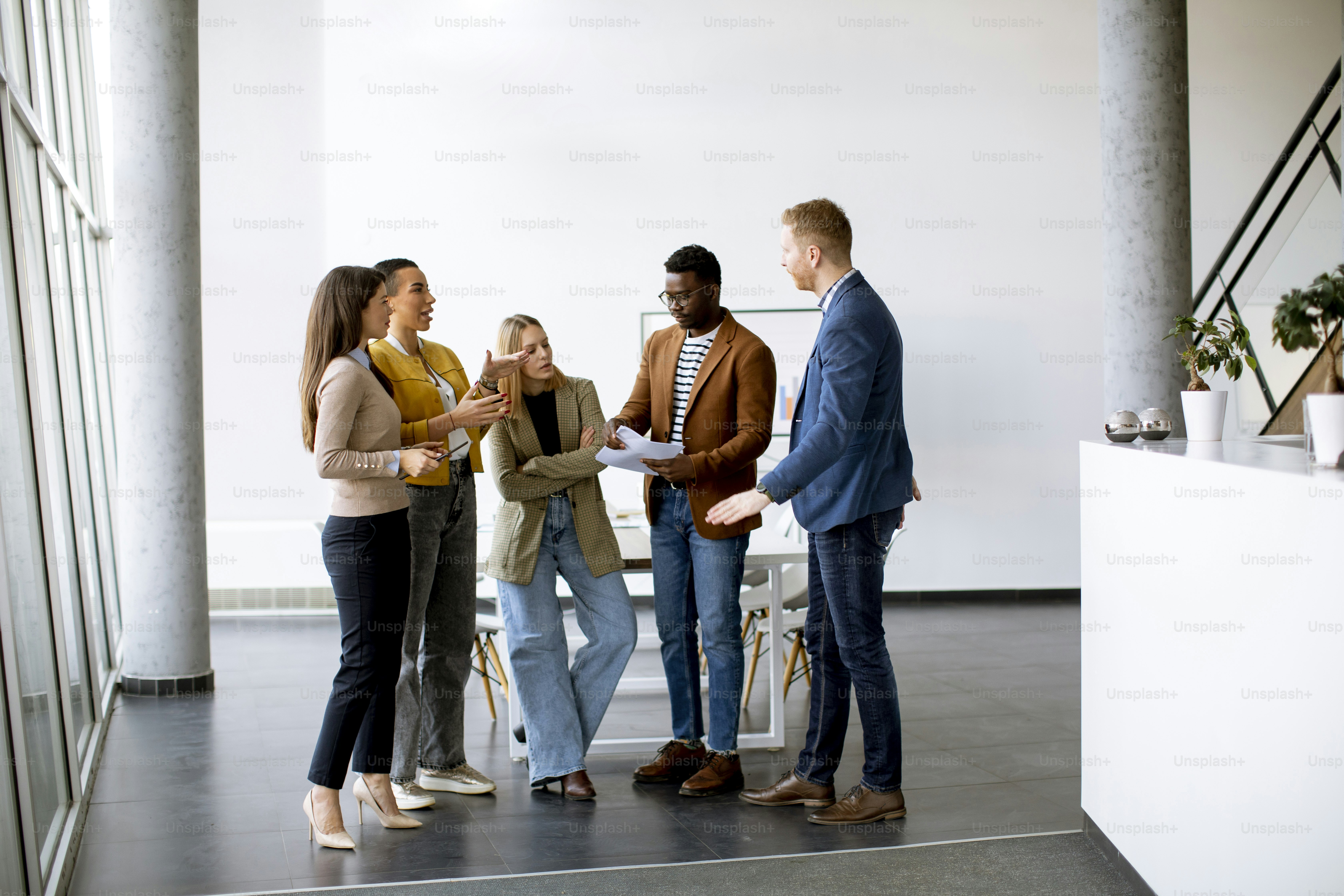 Young creative team working together in the modern office photo ...
