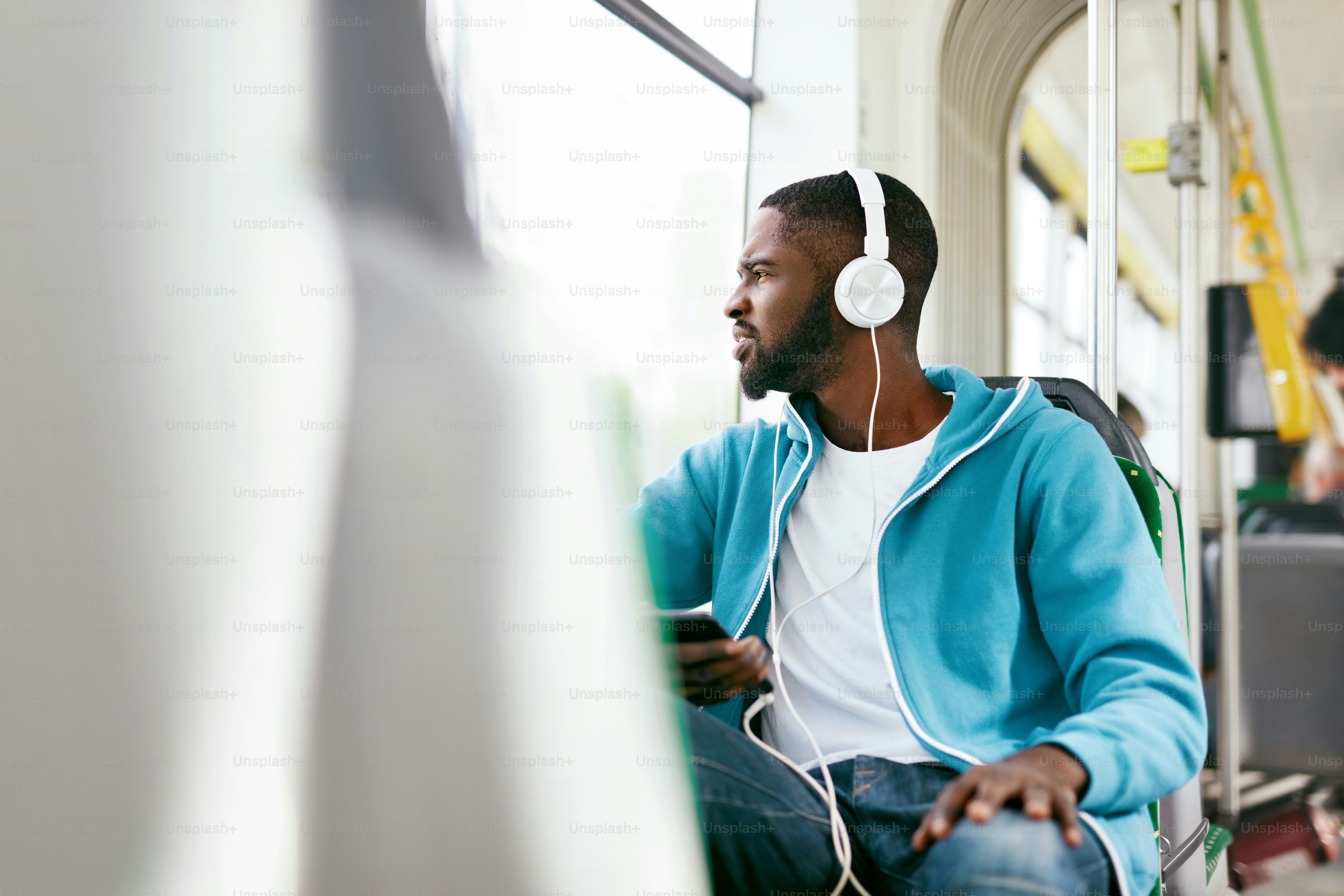 Man Riding Bus, Listening Music With Headphones And Phone In Public ...