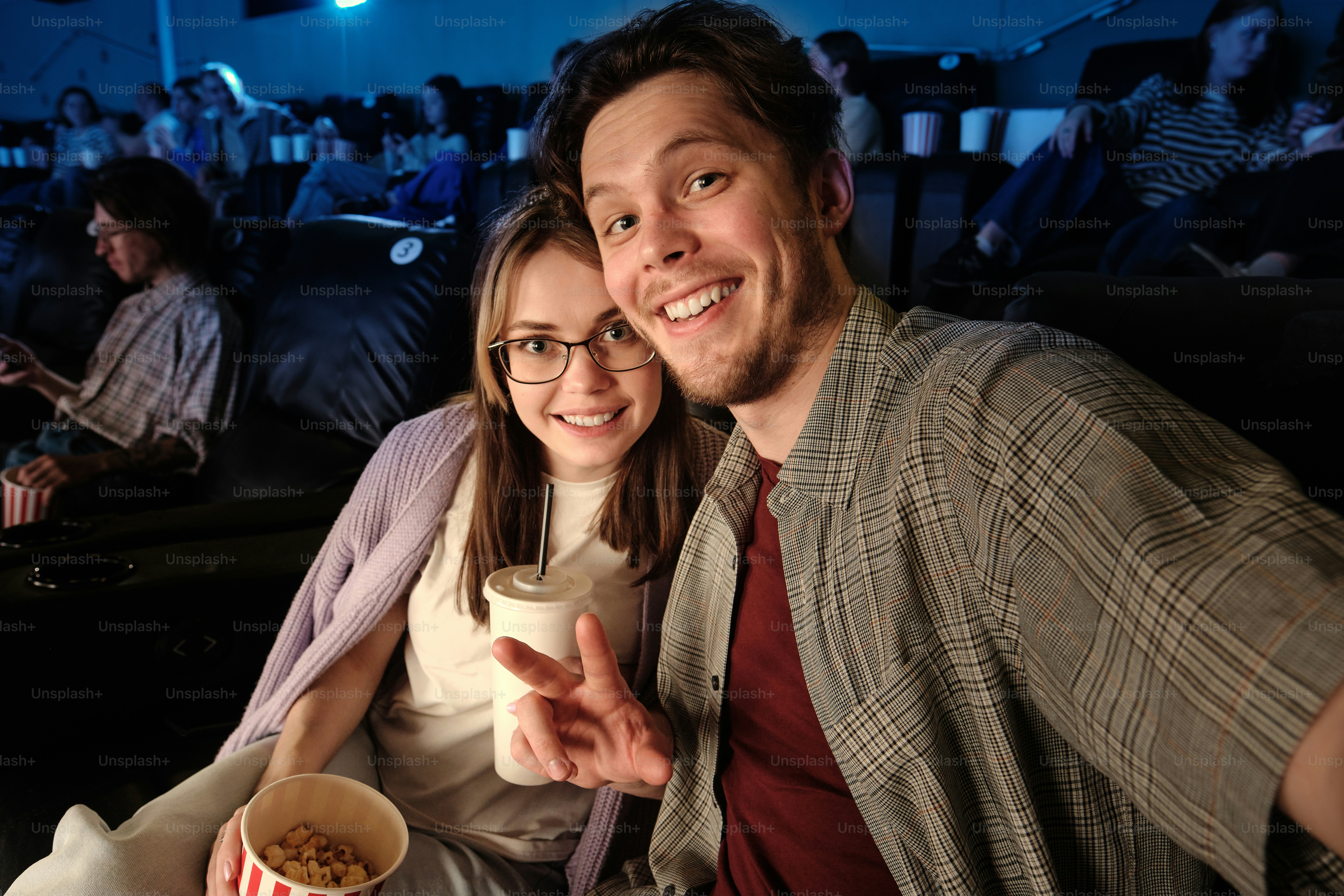 A group of people sitting in a movie theater photo – Film Image on Unsplash