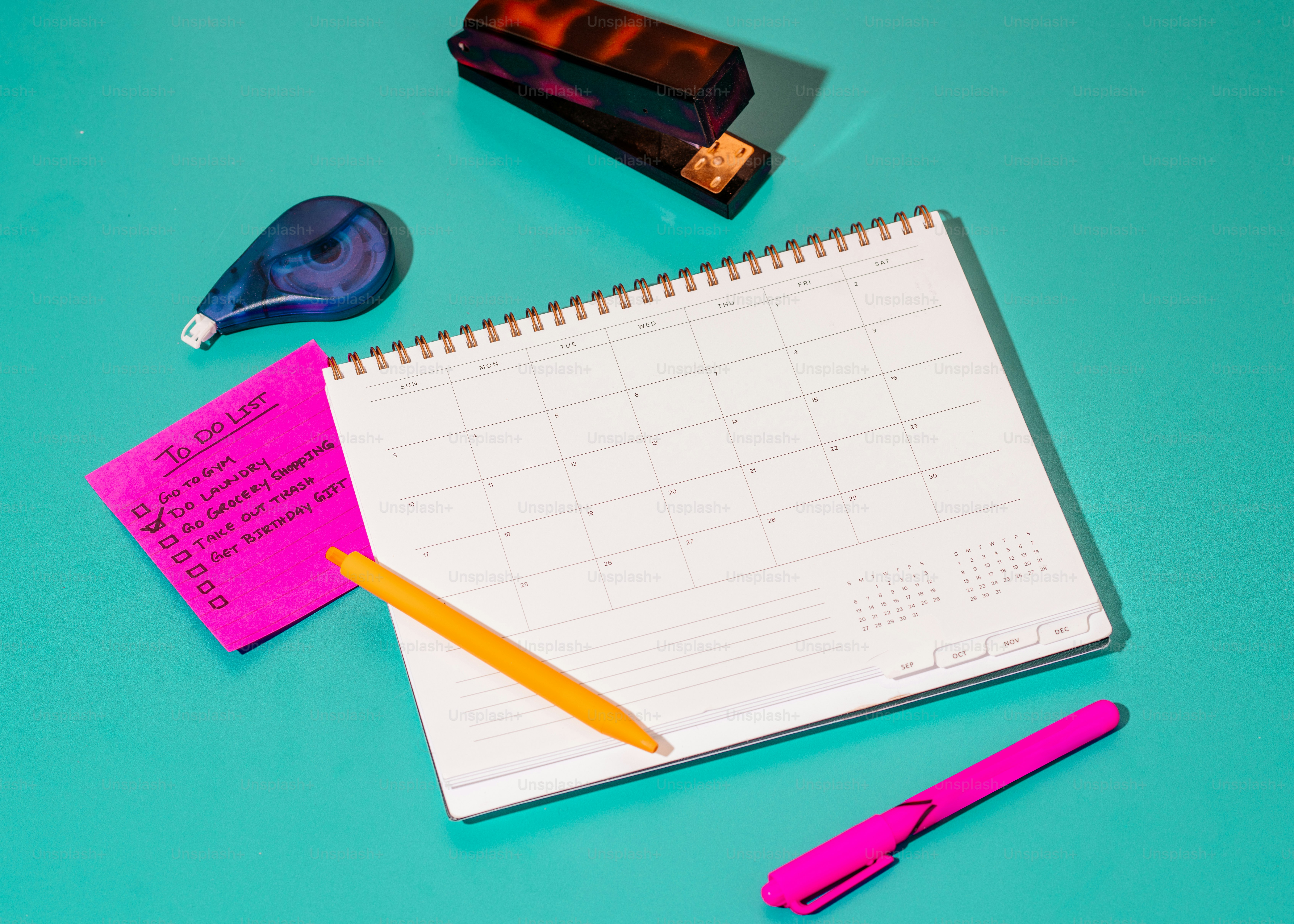 A desk with a calendar, pens, and a marker photo – Motivation Image on ...