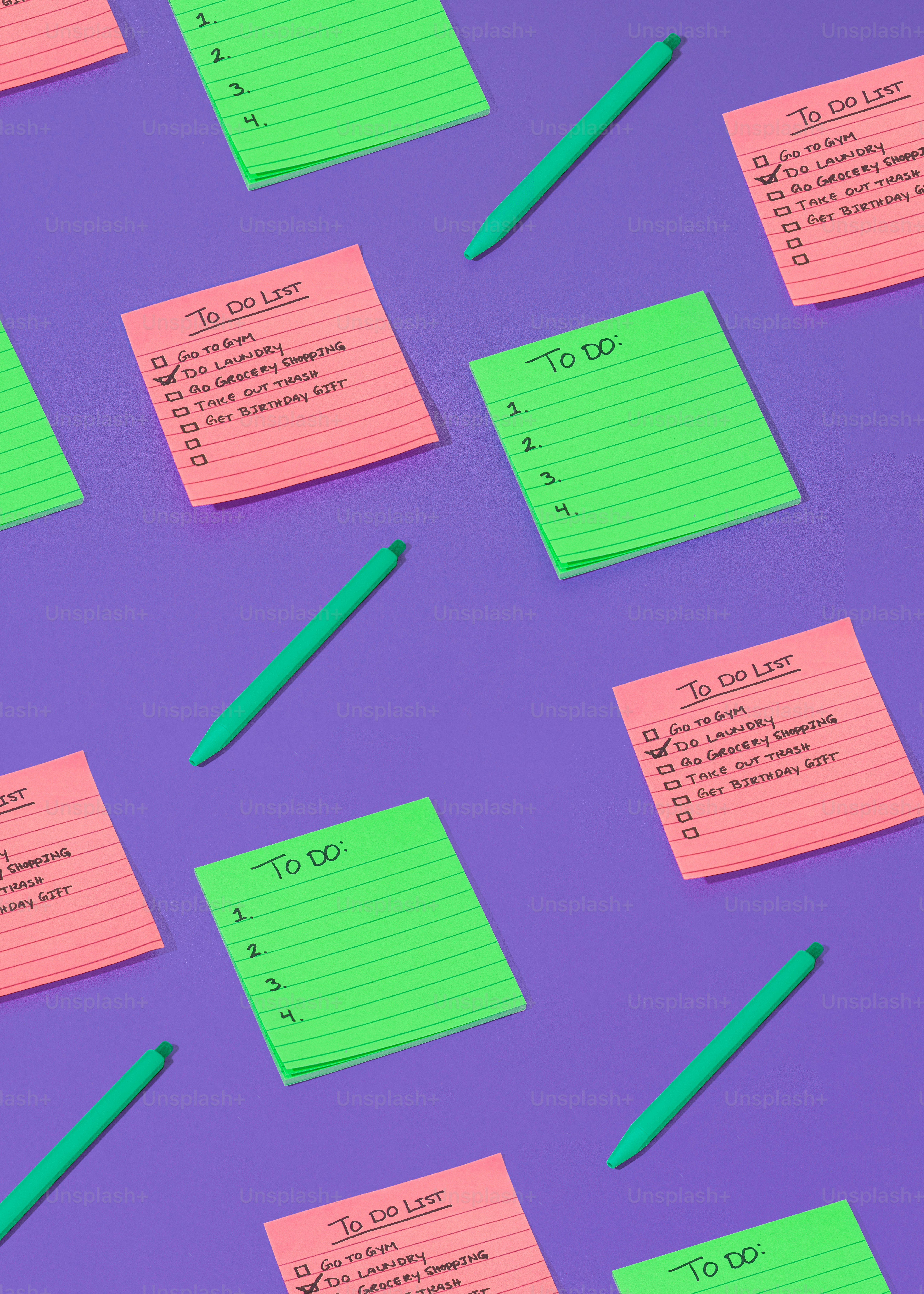 A pile of post it notes sitting on top of a blue table photo – Good ...