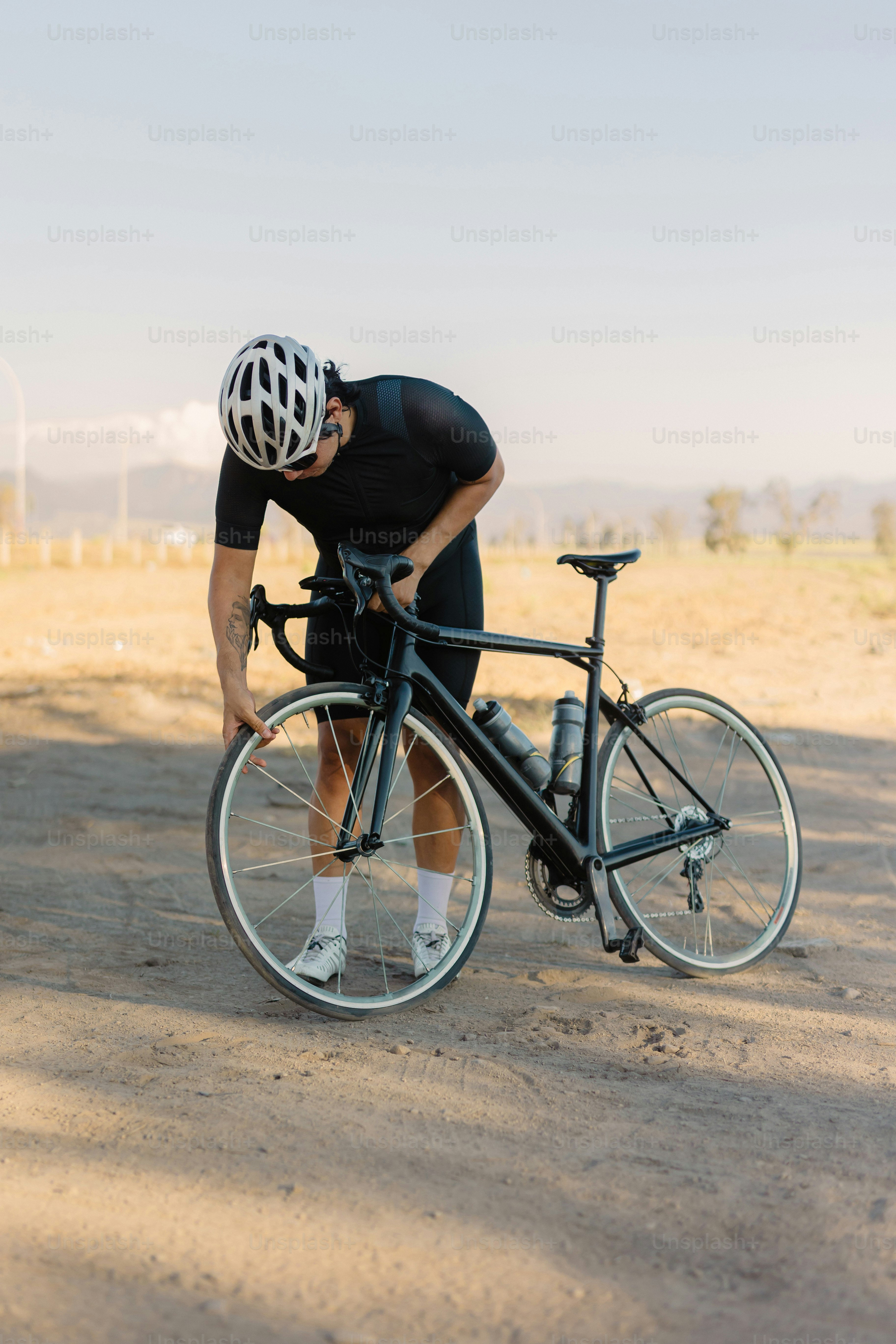 A man bending over on a bike in the dirt photo – Sport Image on Unsplash