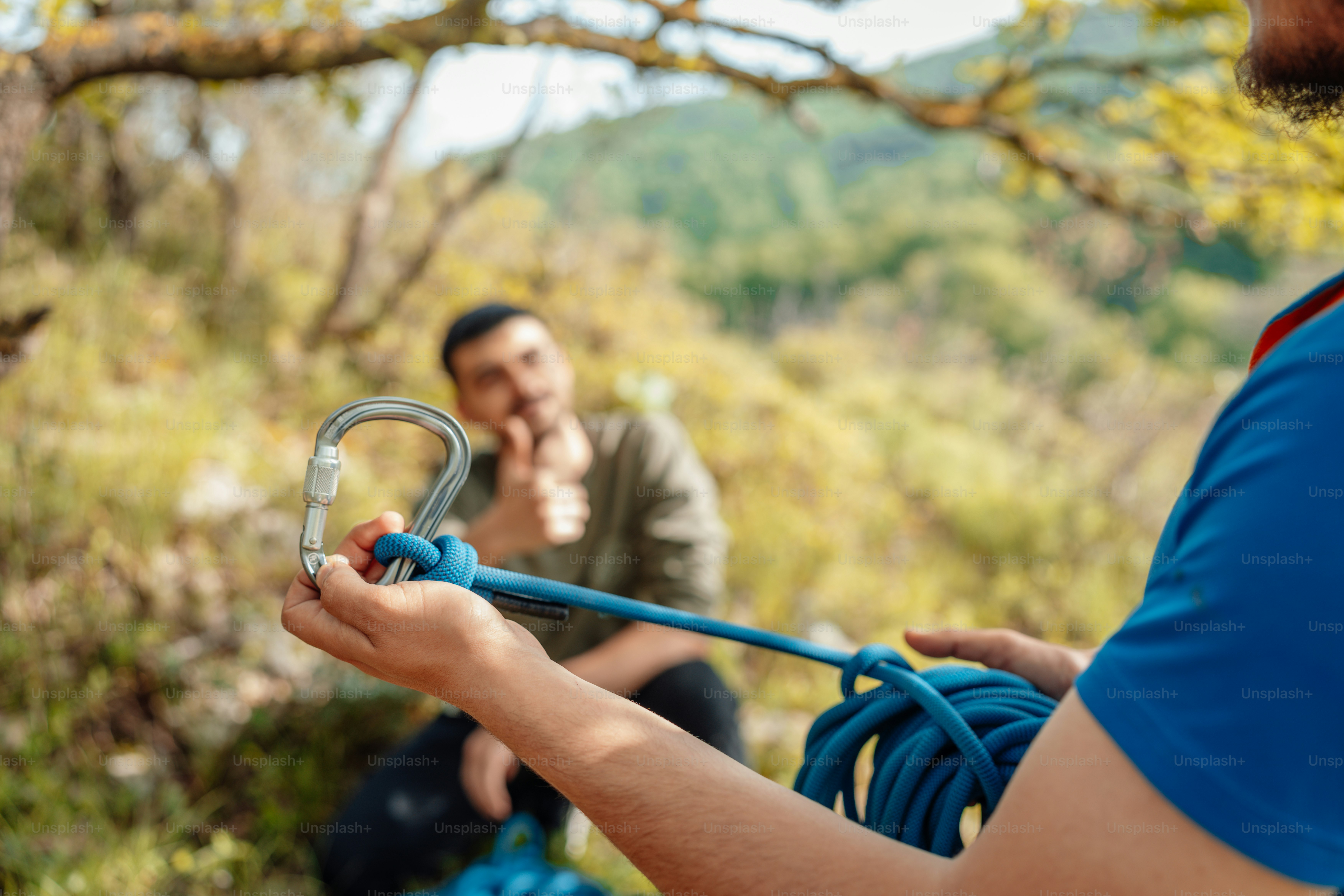 A man holding a pair of scissors in his hand photo – Sport Image on ...