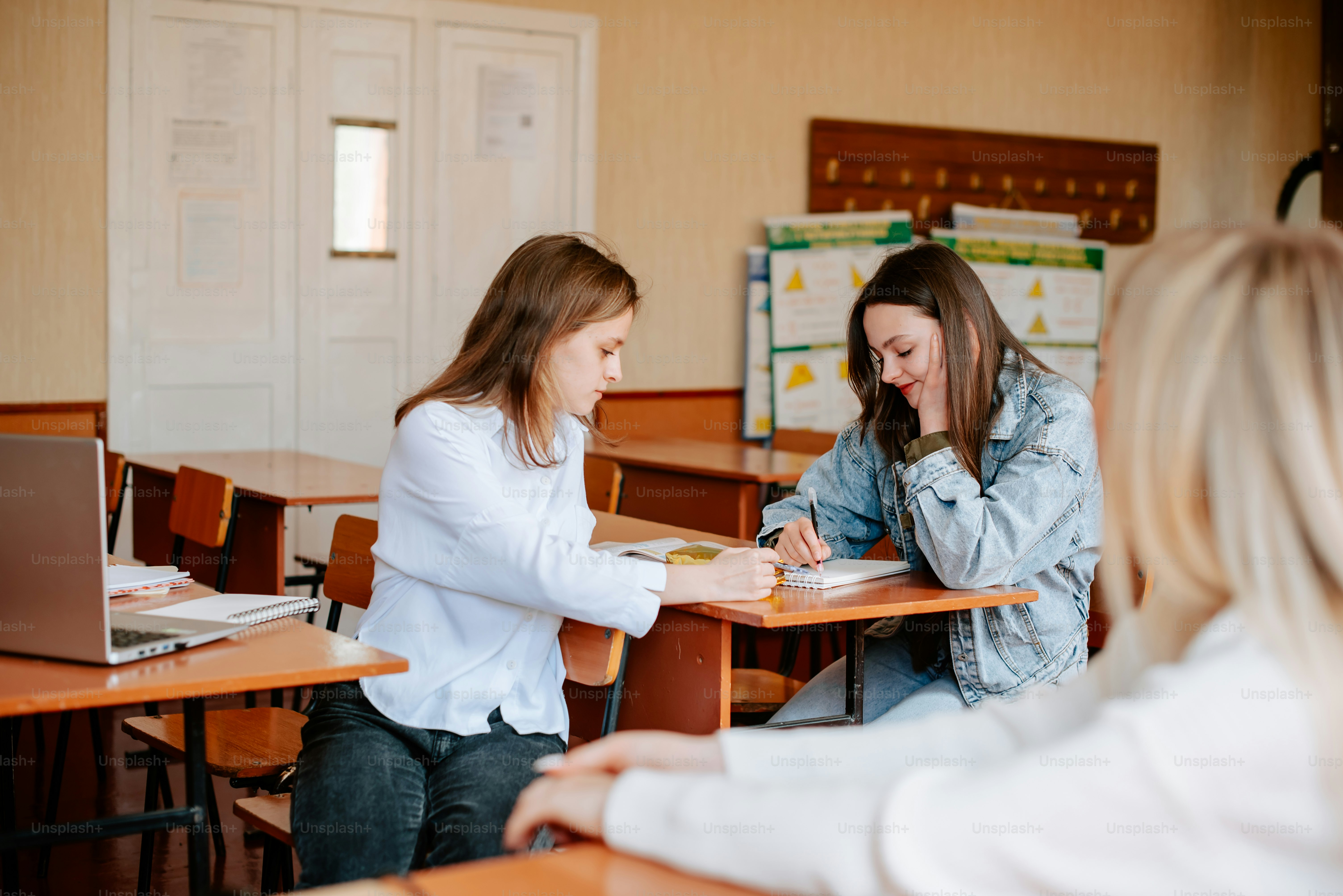 A man teaching a class of students in a classroom photo – Academy Image ...