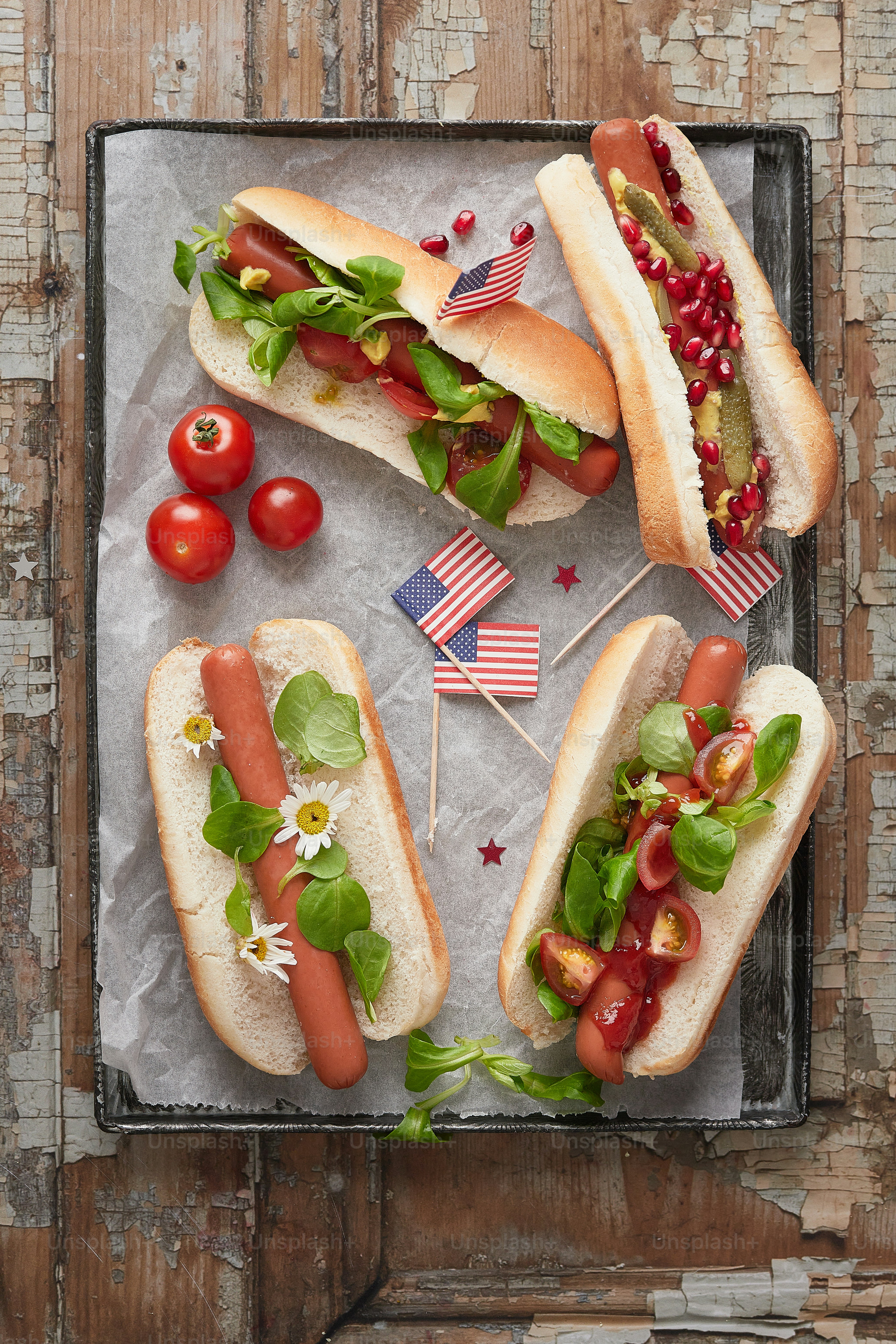 Four hotdogs with toppings on a tray photo – 4th of july Image on Unsplash