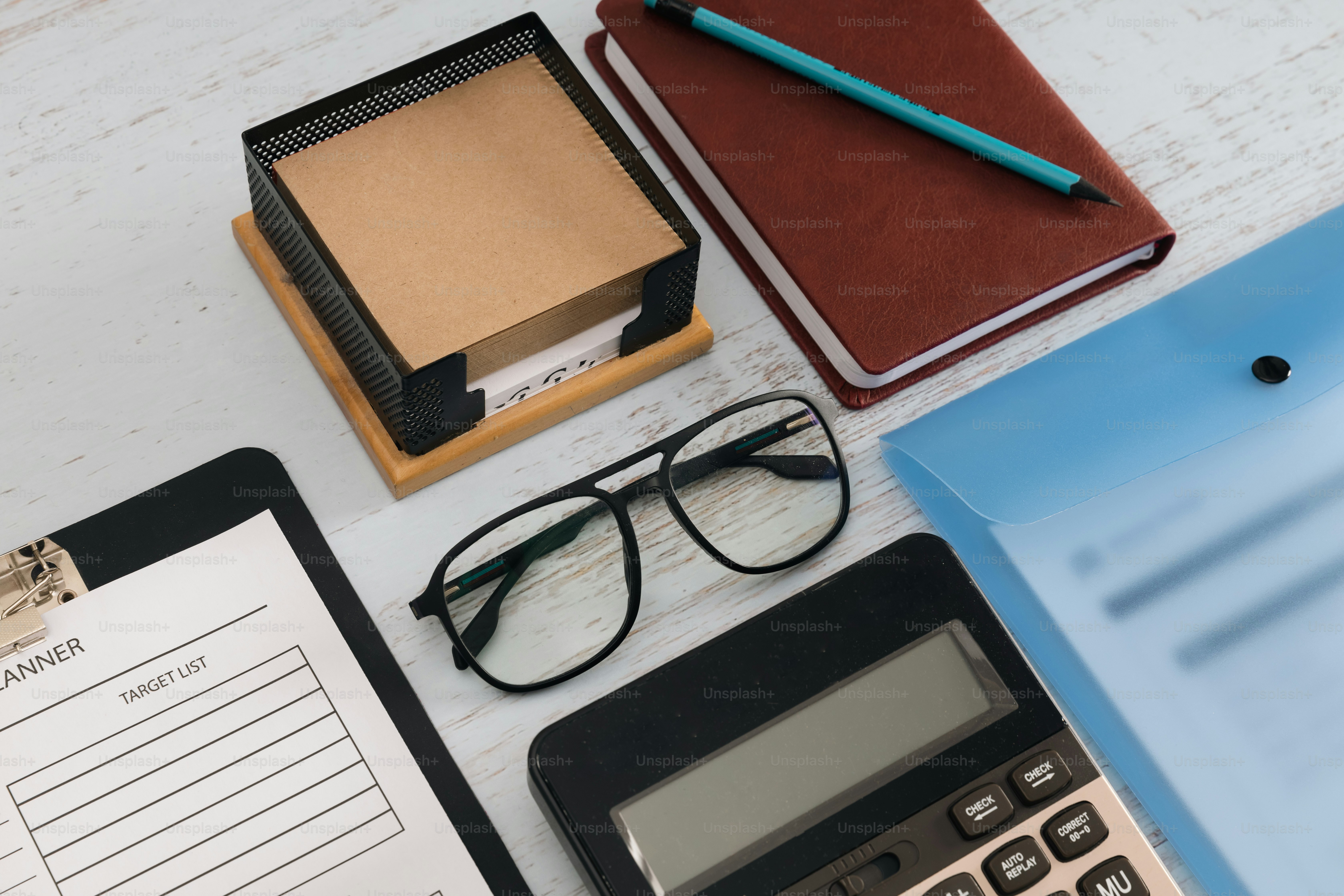 A clipboard with a to - do list on it next to a potted photo – Desk ...