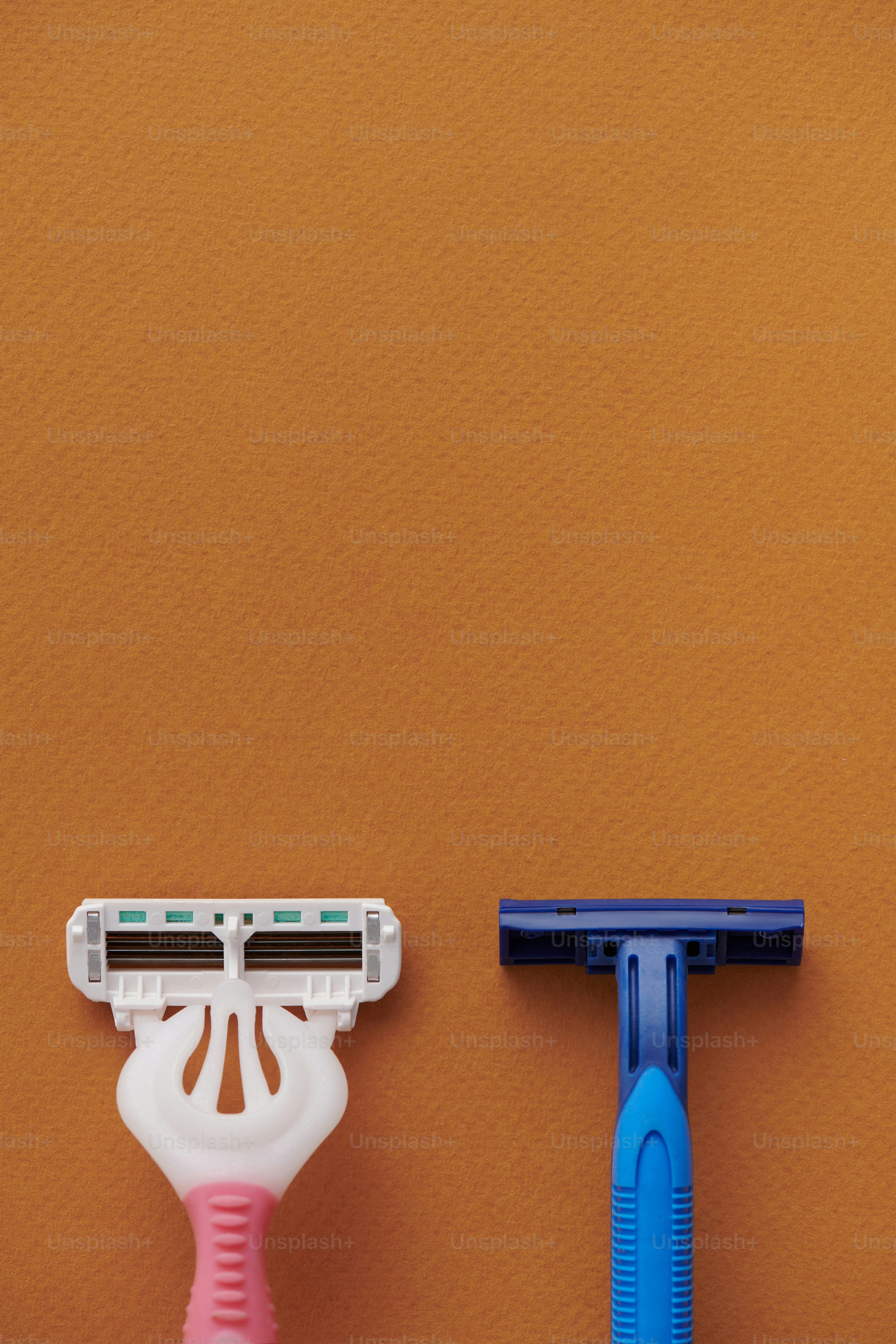 A couple of toothbrushes sitting next to each other photo – Razor Image ...