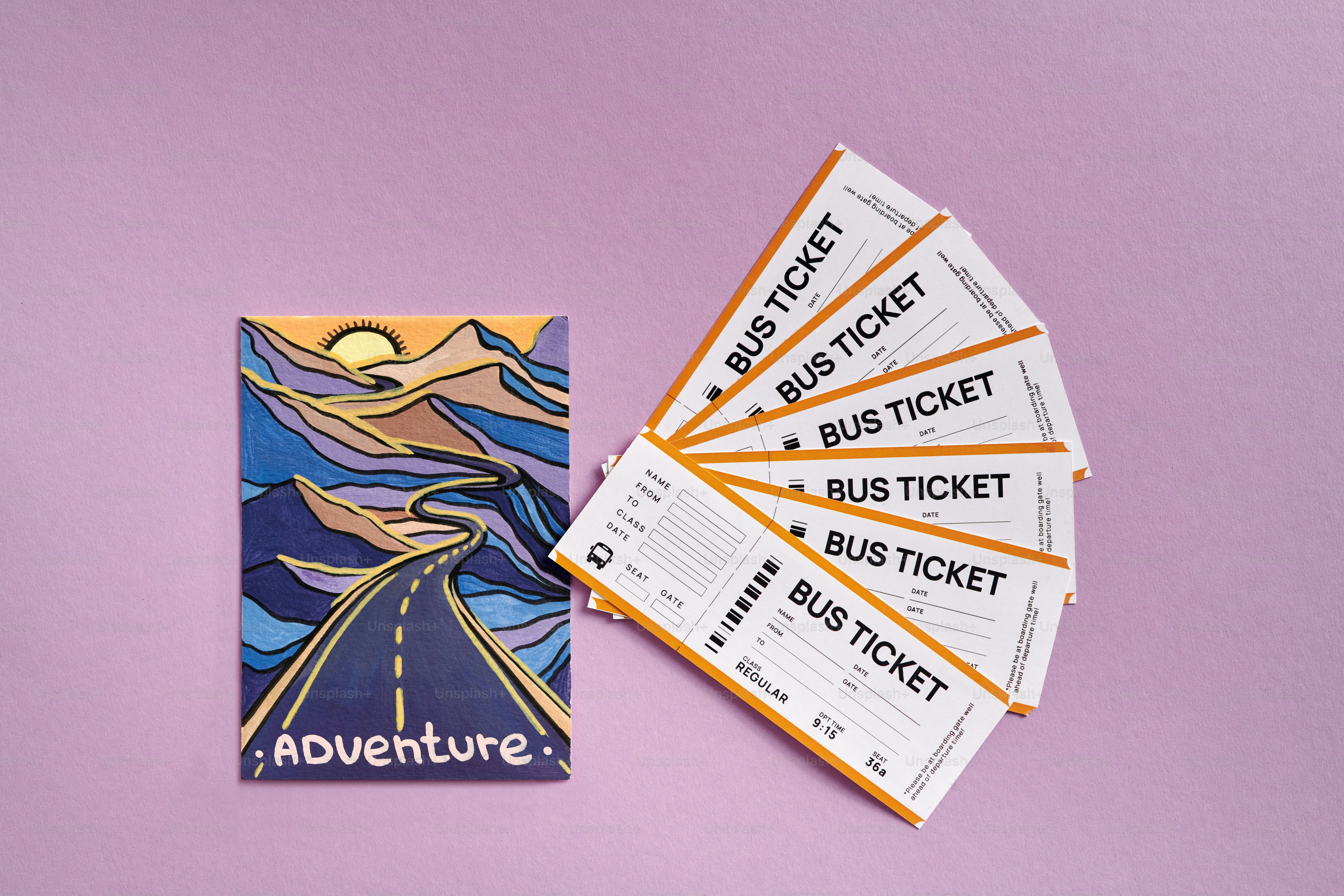 A bus ticket sitting on top of a purple surface photo – Postcard Image ...
