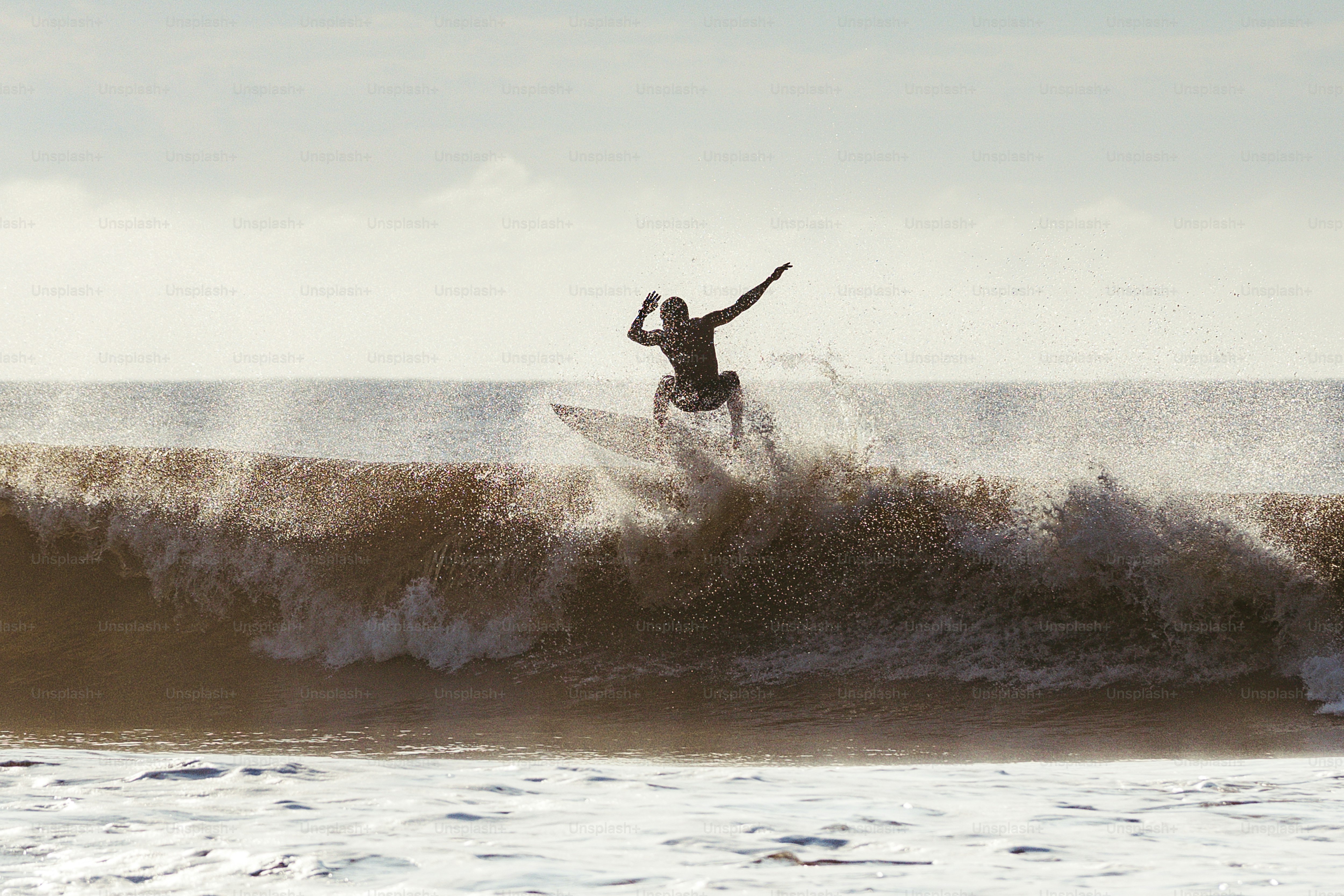 A man riding a wave on top of a surfboard photo – Sea waves Image on ...