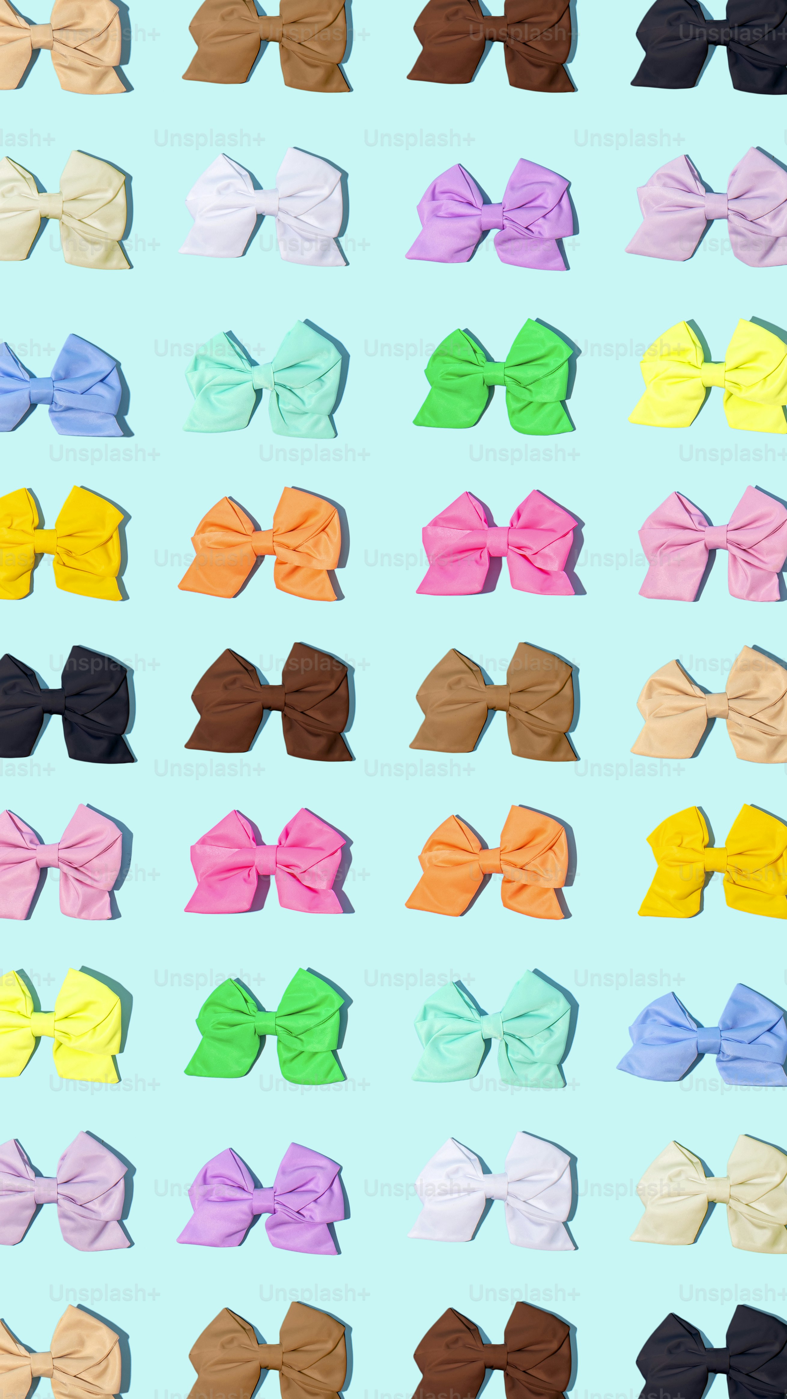 A bunch of different colored bows on a blue background photo – Colorful ...