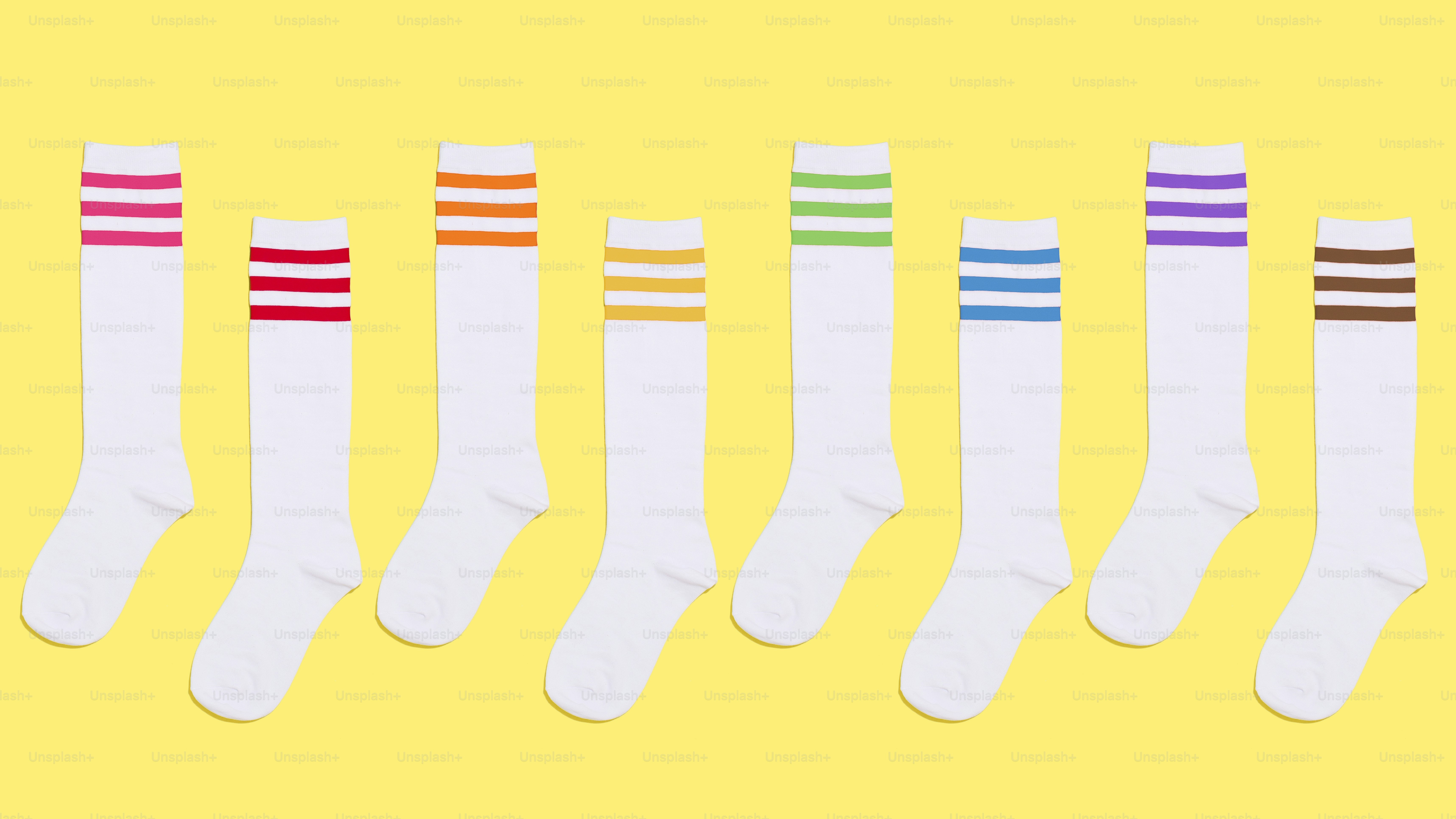 Five pairs of white socks with multi - colored stripes photo – Sock ...