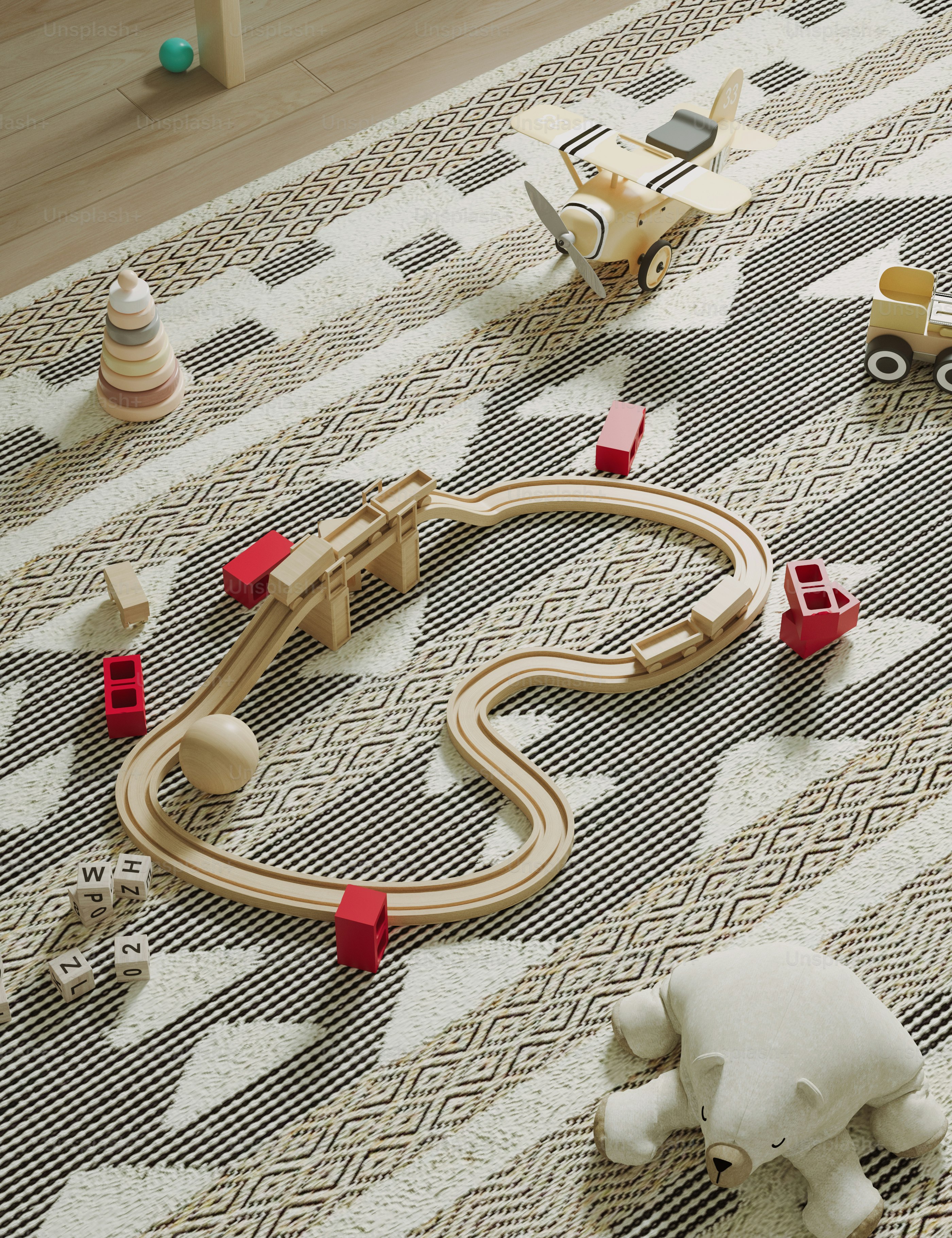 A child's play area with toys on the floor photo – Toy train Image on ...