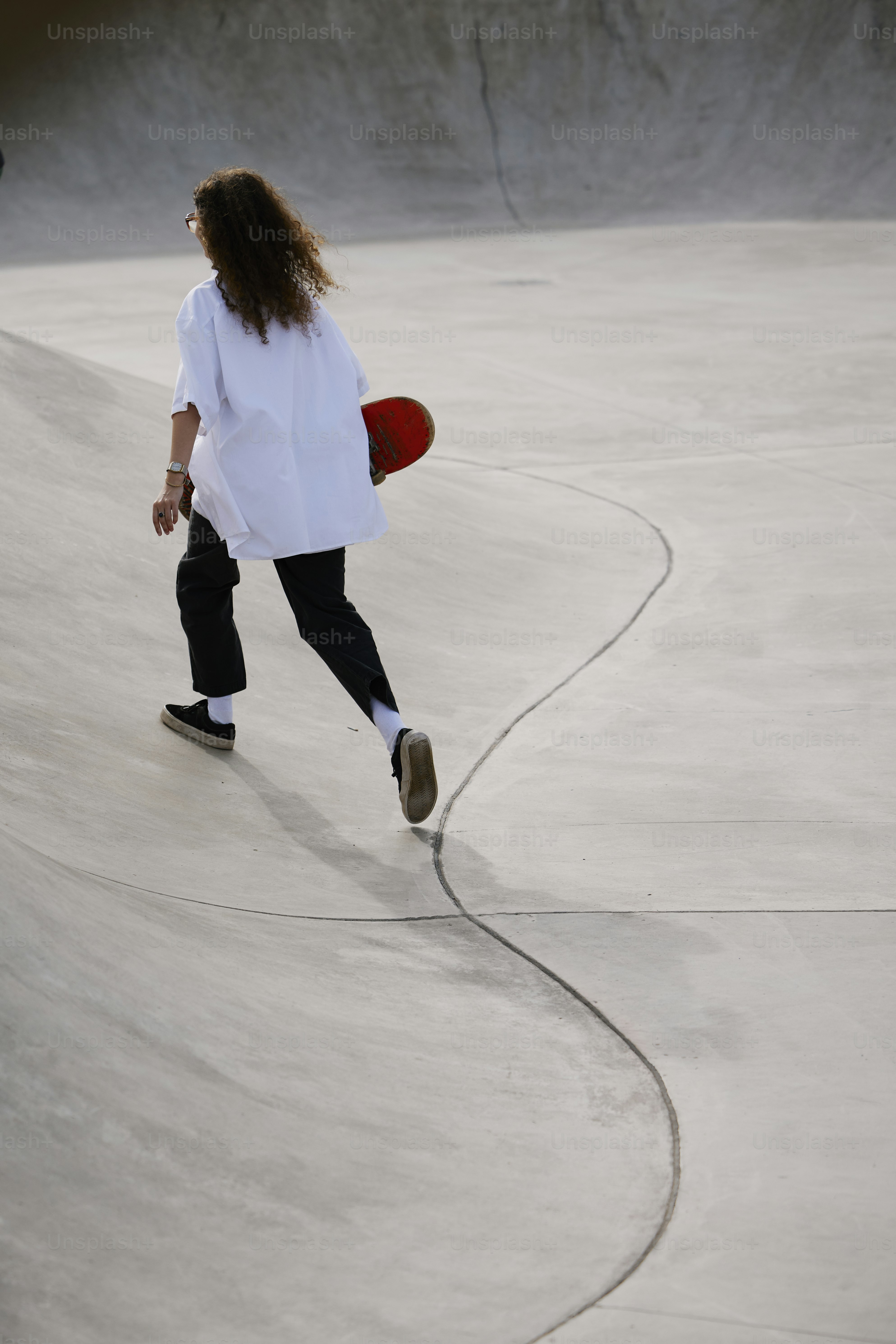 A person riding a skate board on a ramp photo – Woman Image on Unsplash
