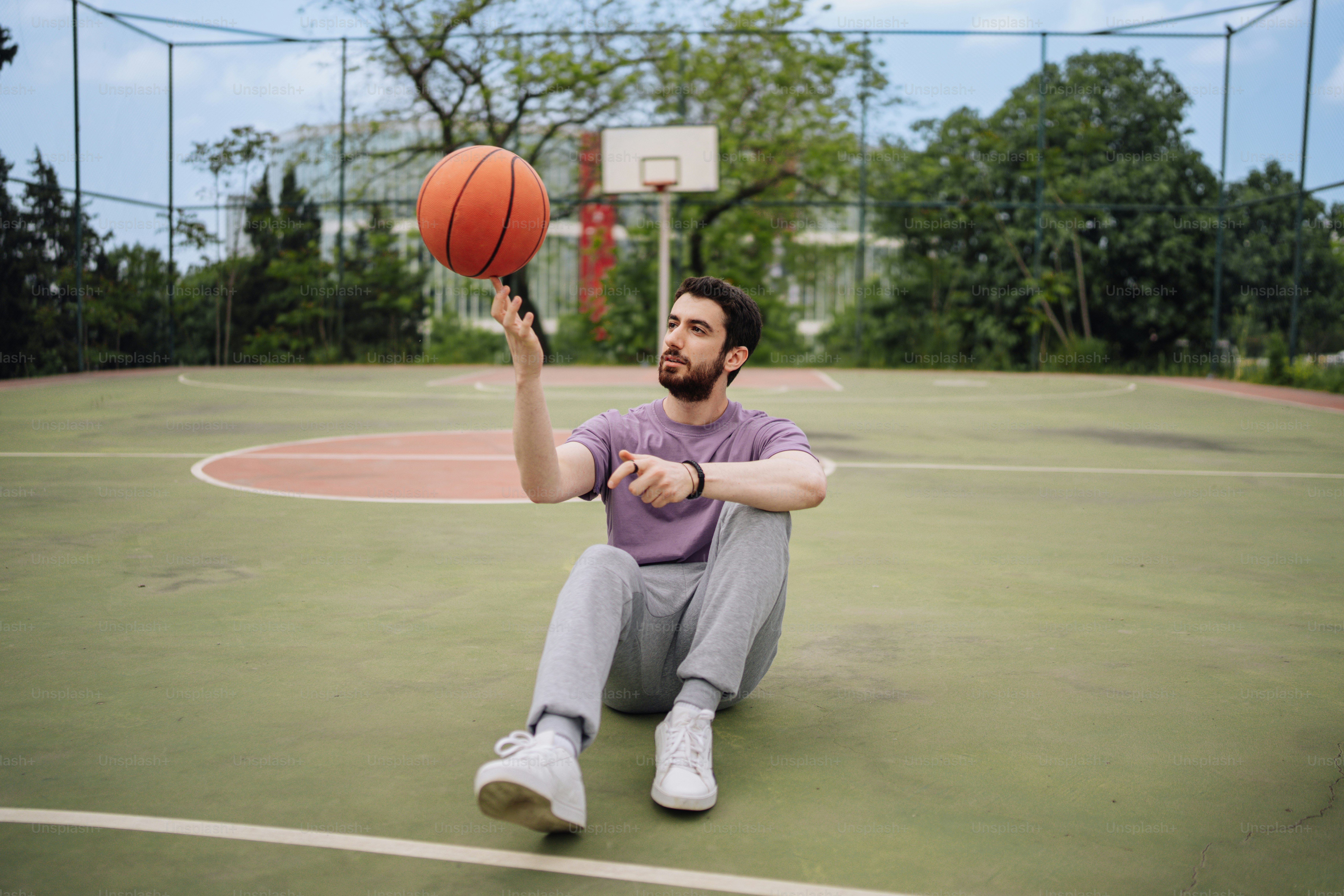 A basketball sitting on top of a basketball court photo – Basketball ...
