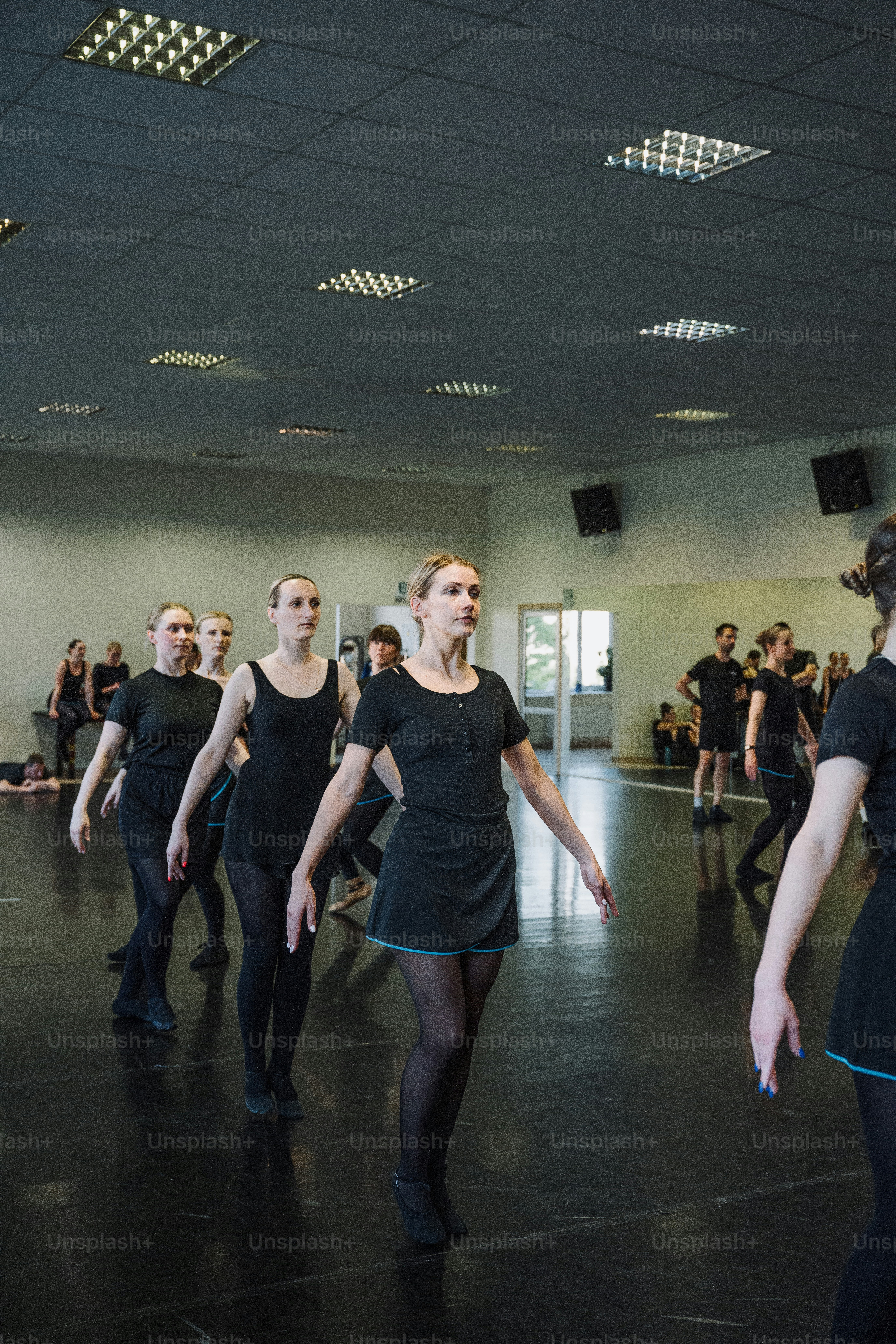 A group of people dancing in a dance studio photo – Ballet class Image ...