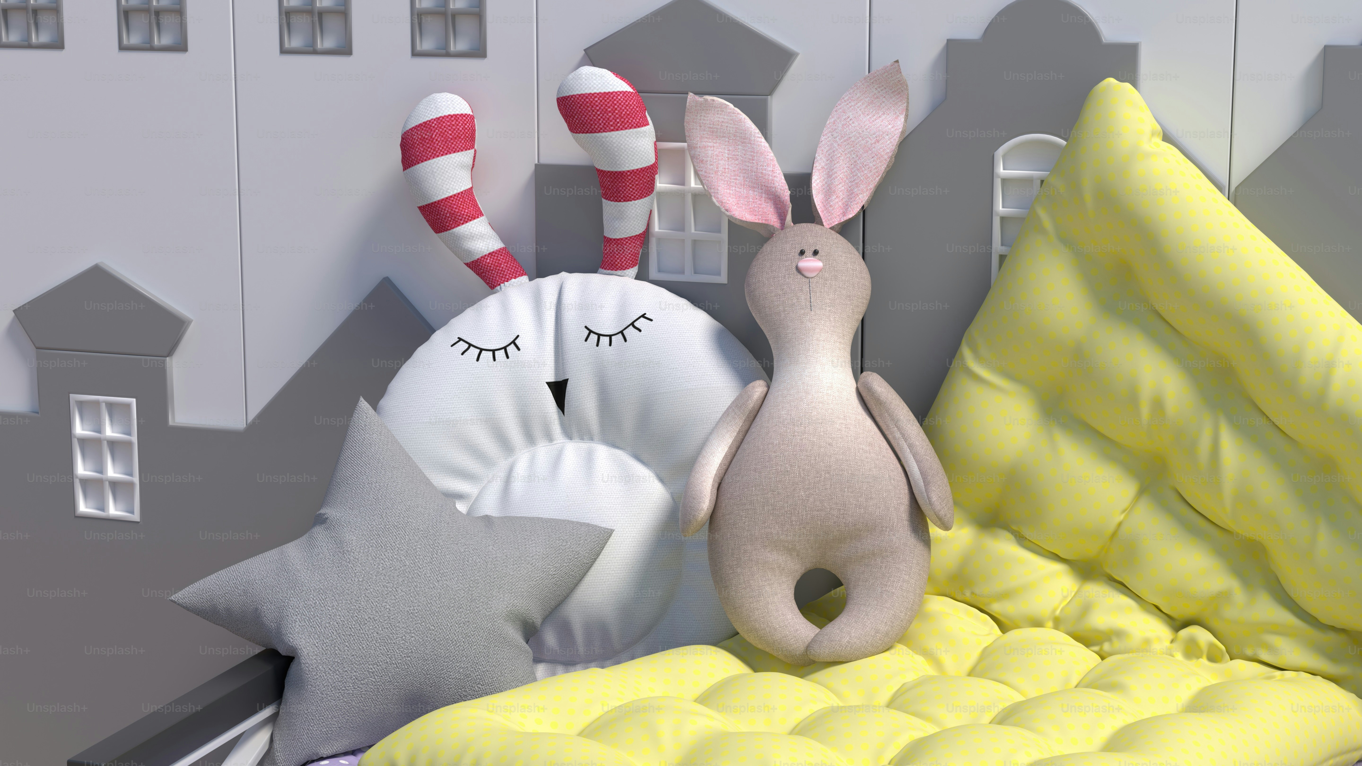 Two stuffed animals sitting next to each other on a bed photo – Image ...