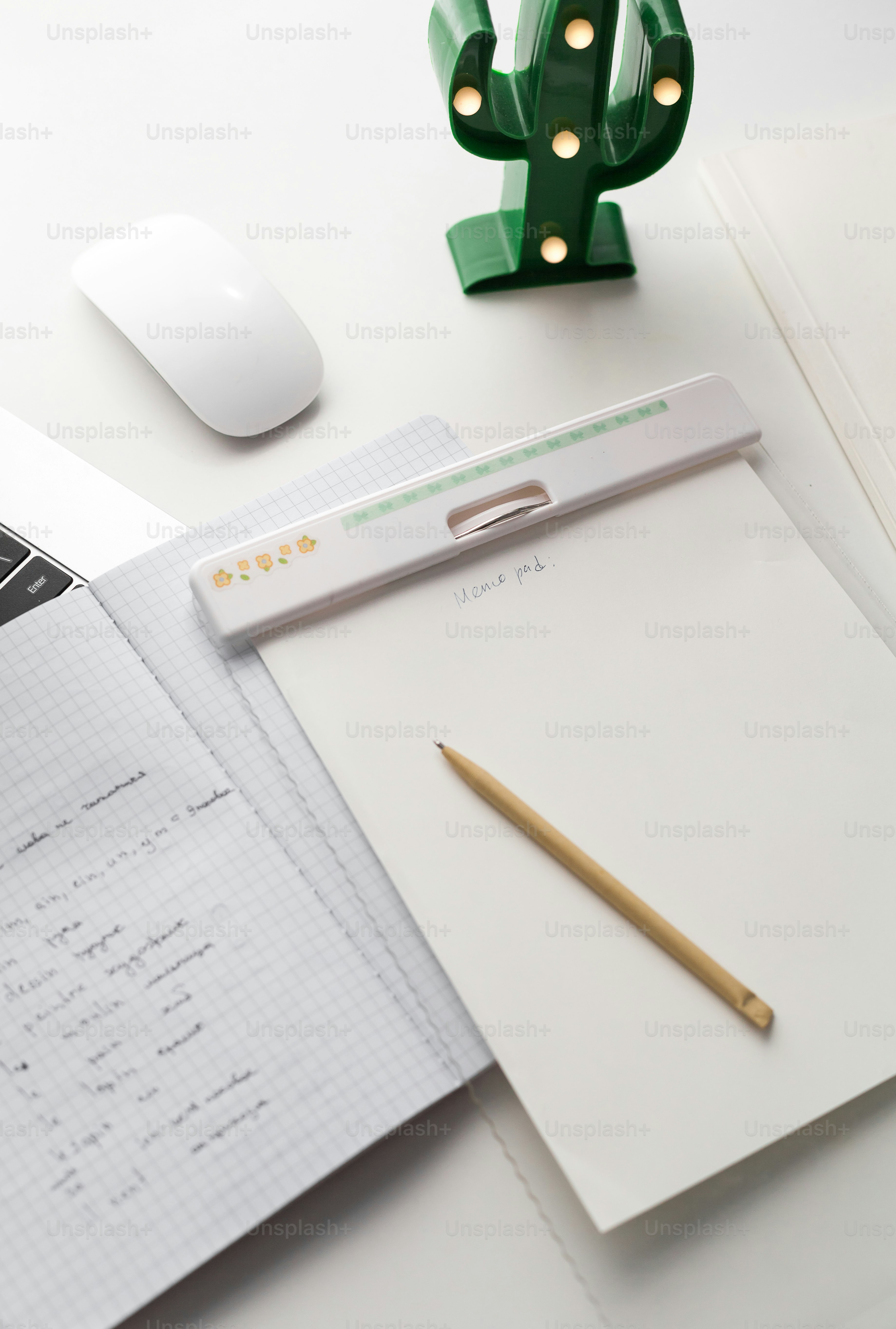 A notepad, pen, notebook, and envelope on a table photo – Desk Image on ...