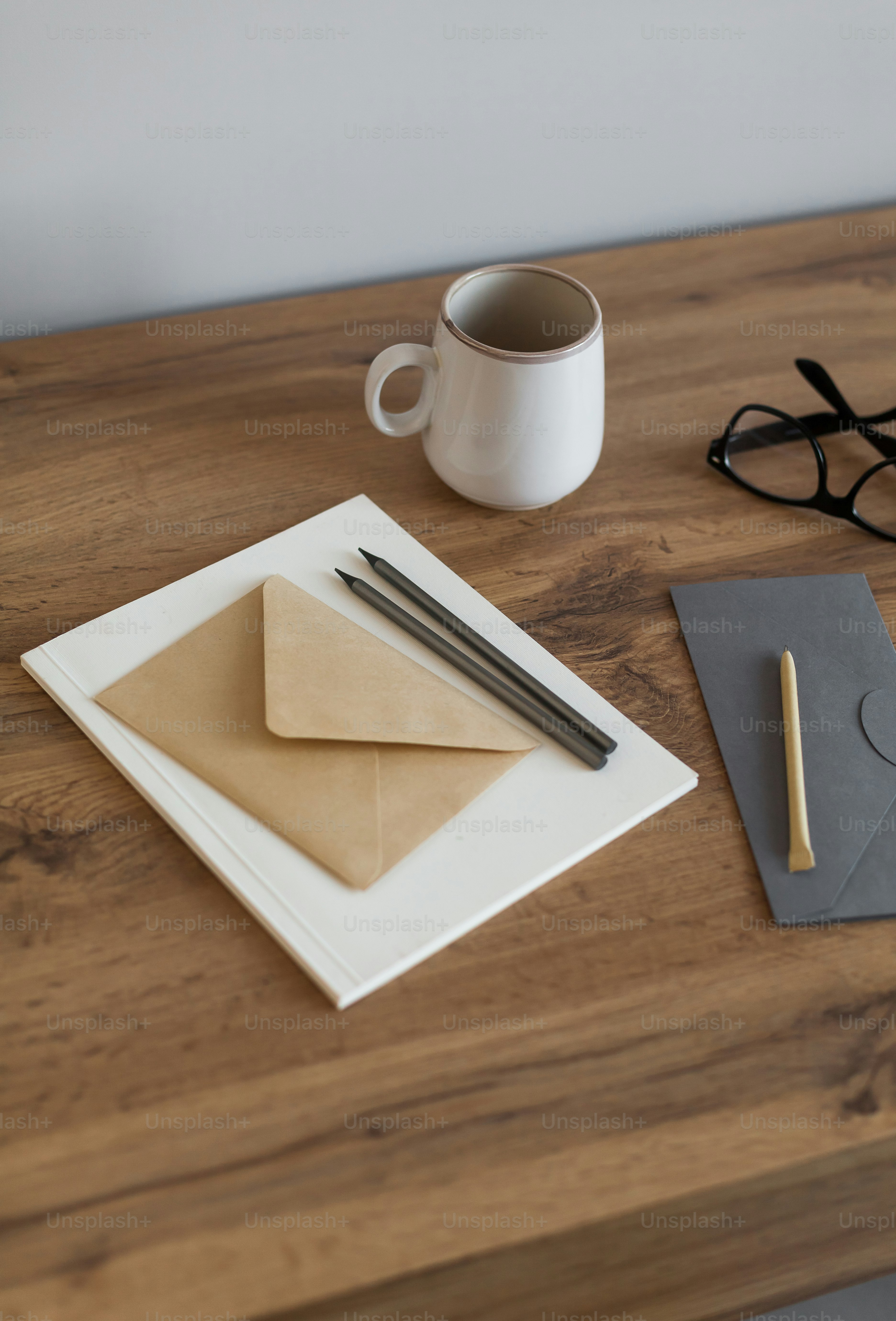 A wooden table with a cup of coffee and a pair of chopsticks photo ...
