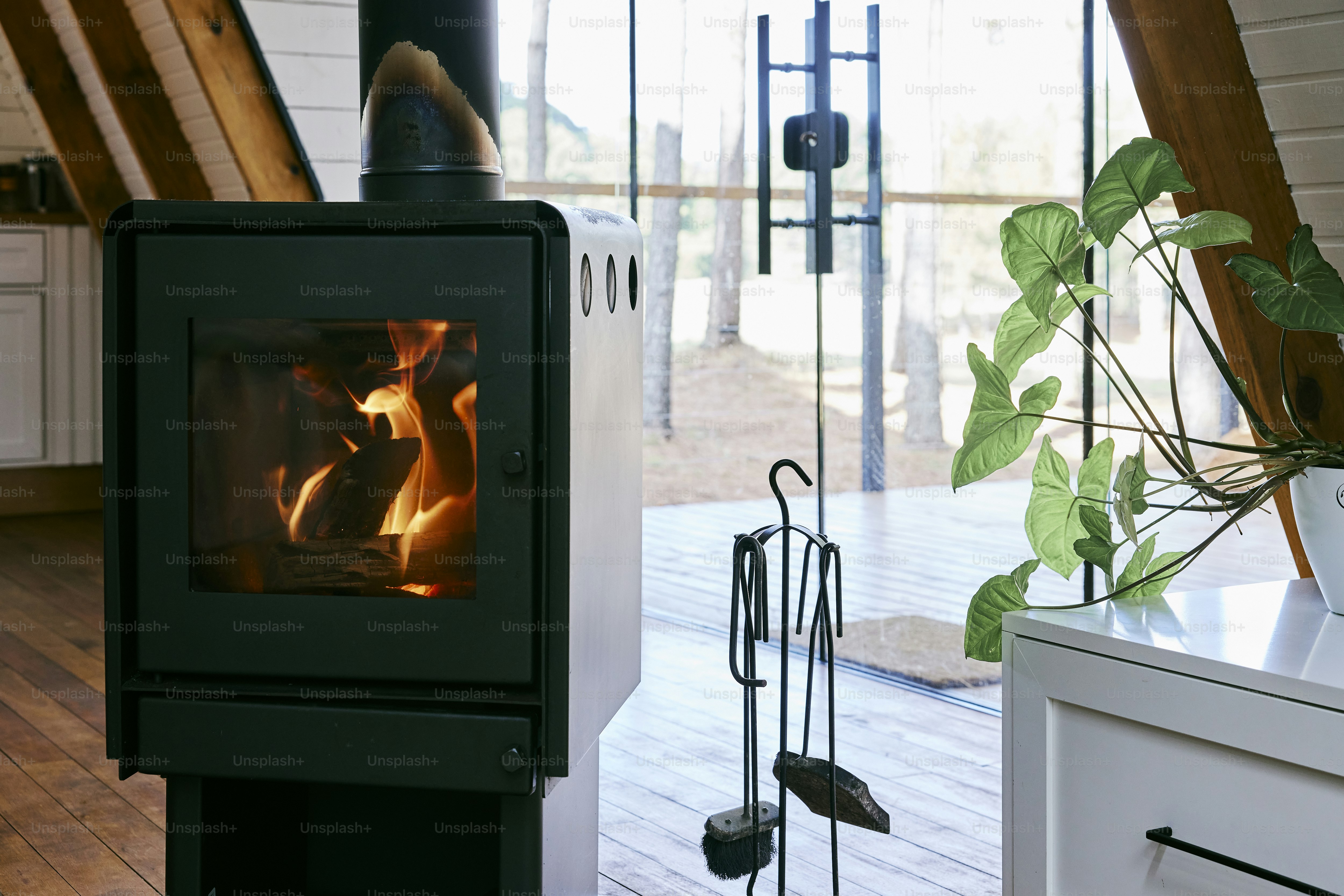 A kitchen with a stove top oven and a window photo – Kitchen Image on ...