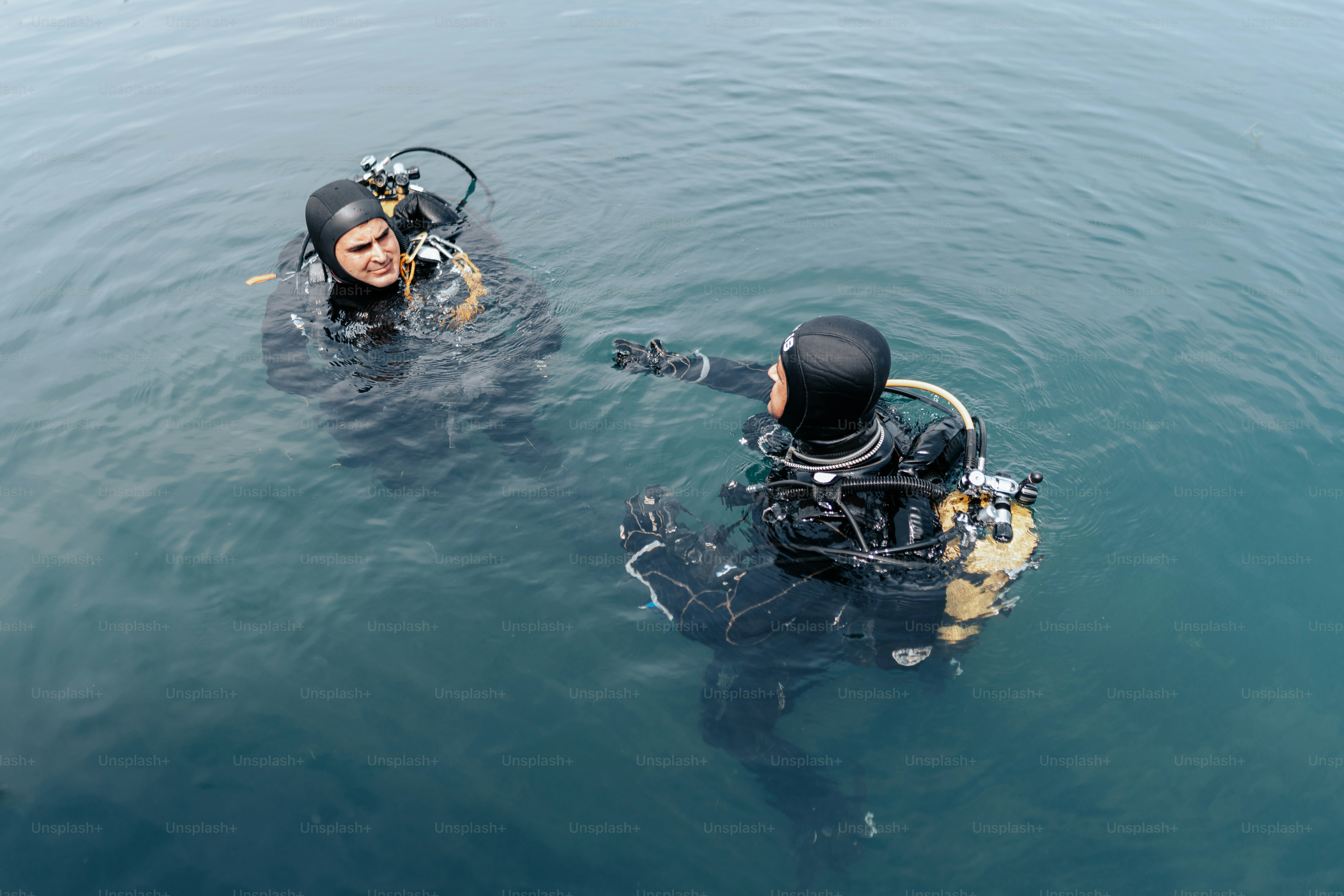 A person in the water with a scuba equipment photo – Marine police ...
