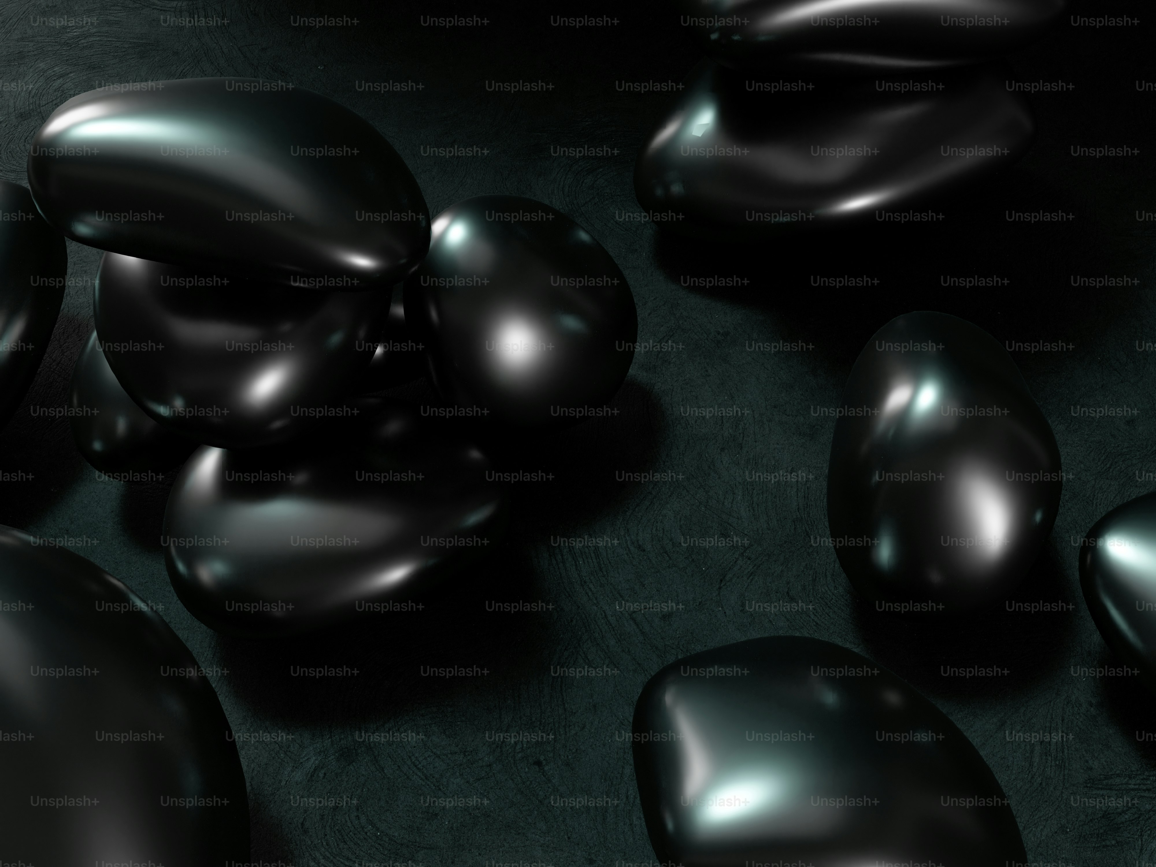 A group of shiny rocks on a black surface photo – Wallpaper Image on ...