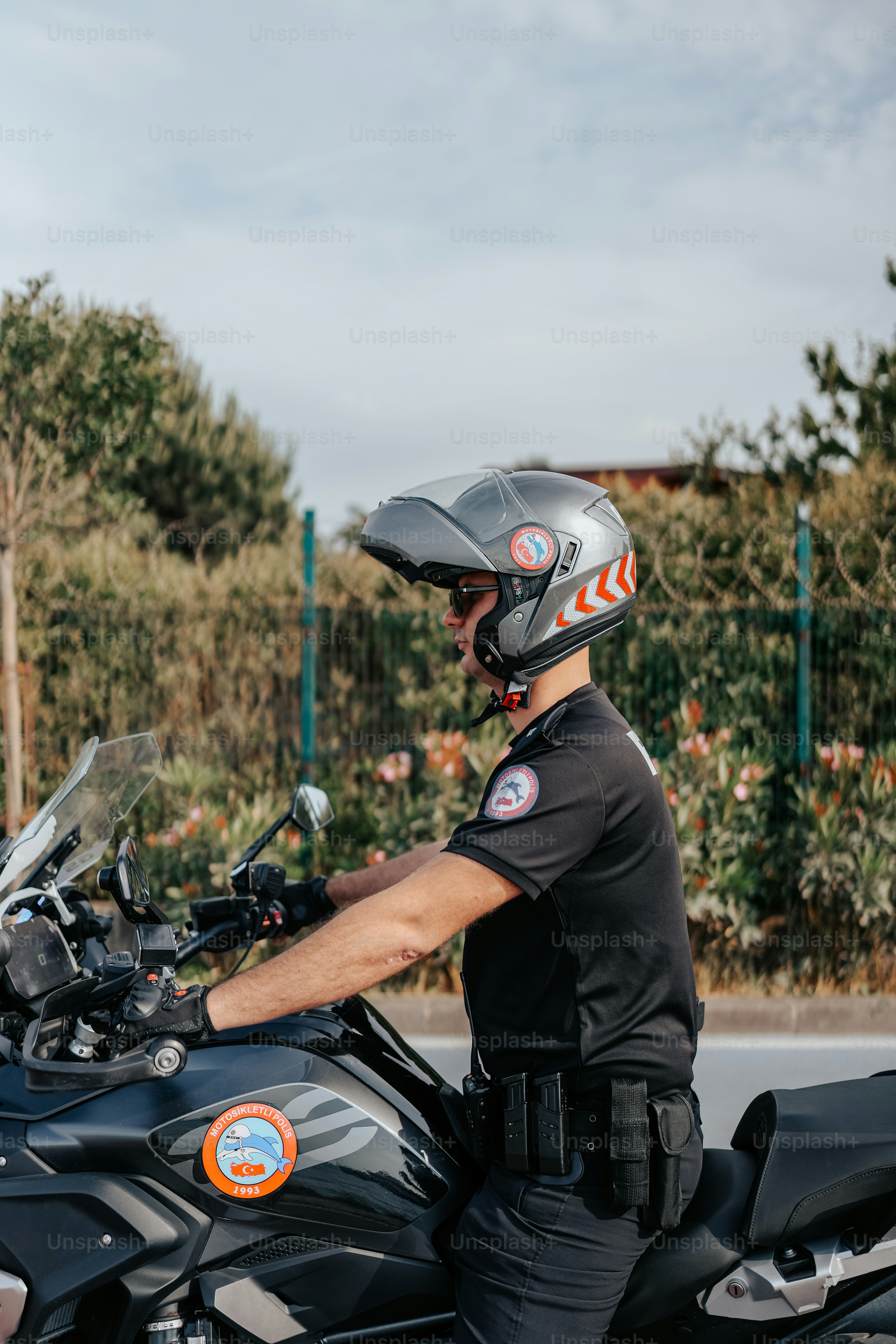 A police officer on a motorcycle wearing a helmet photo – Police Image ...