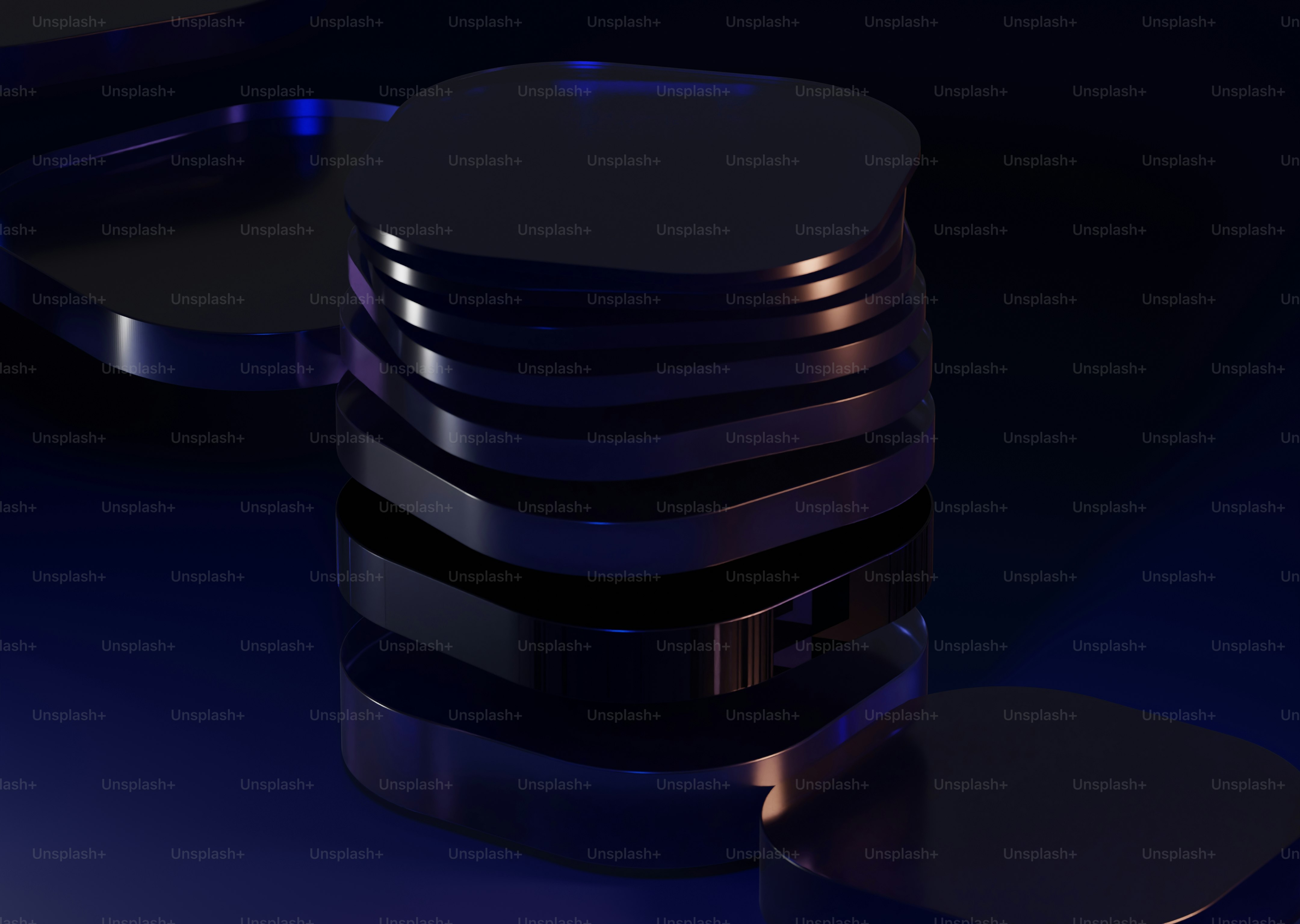 A stack of round objects sitting on top of a table photo – Dark mode ...