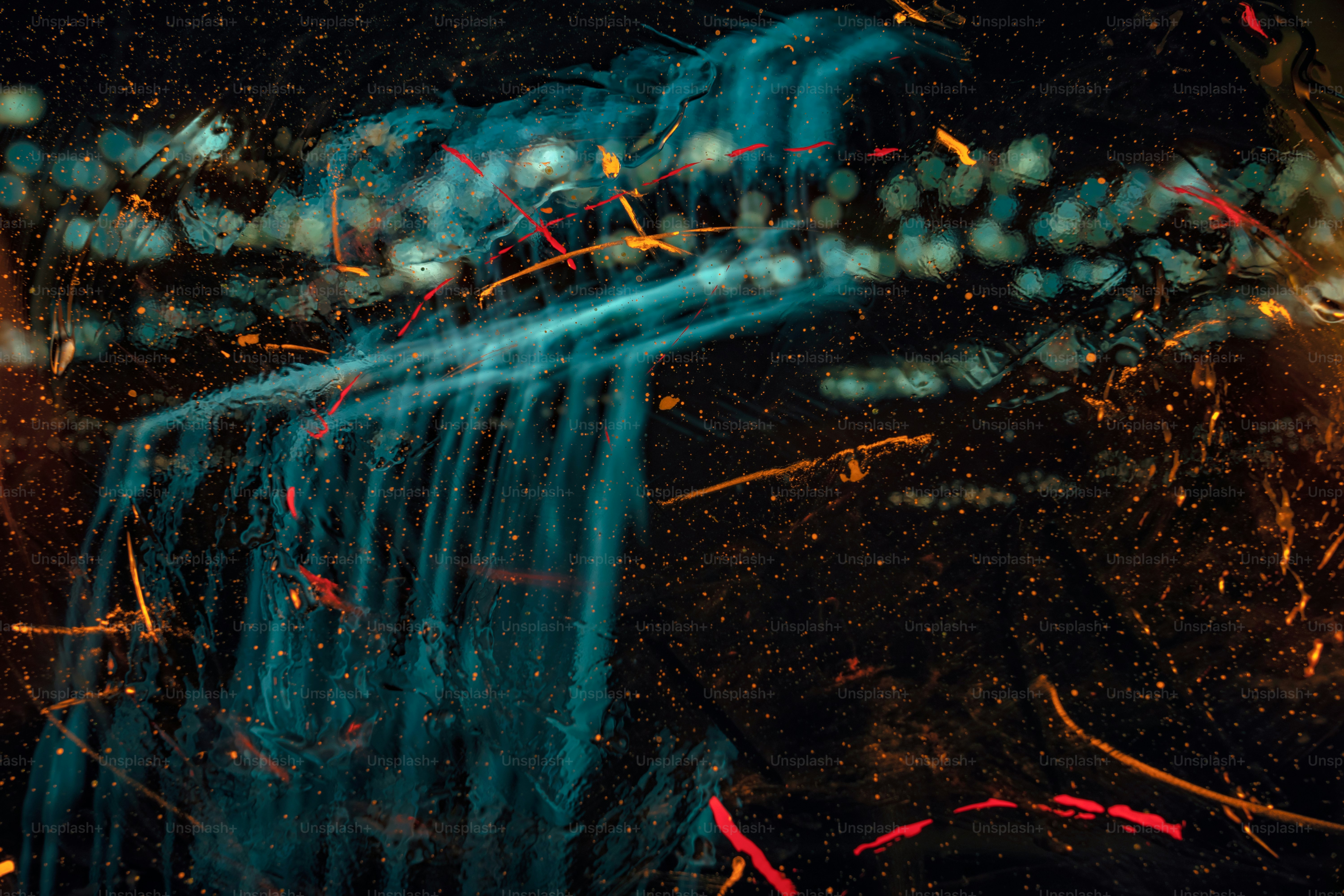 A picture of a waterfall taken through a window photo – Dark mode Image ...